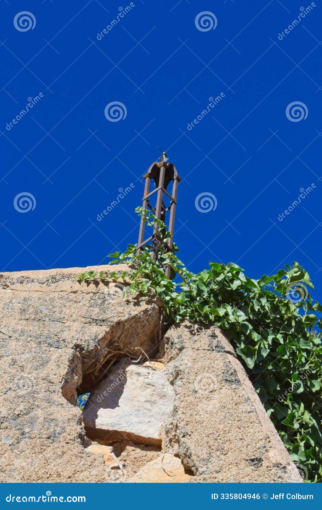 Crumbling Wall of an Old Structure with an Iron Fence Post. Stock Photo ...