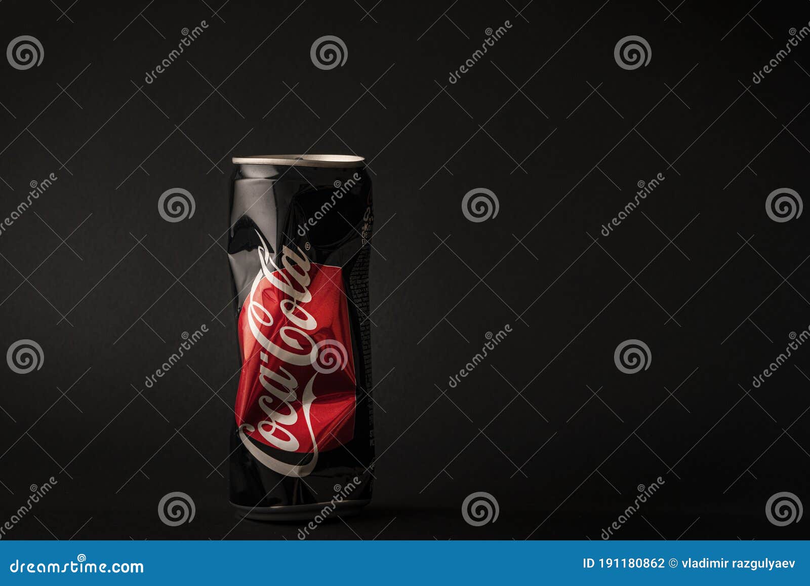 A Crumpled Coca-Cola Can on a Black Background, Copy Space Editorial ...