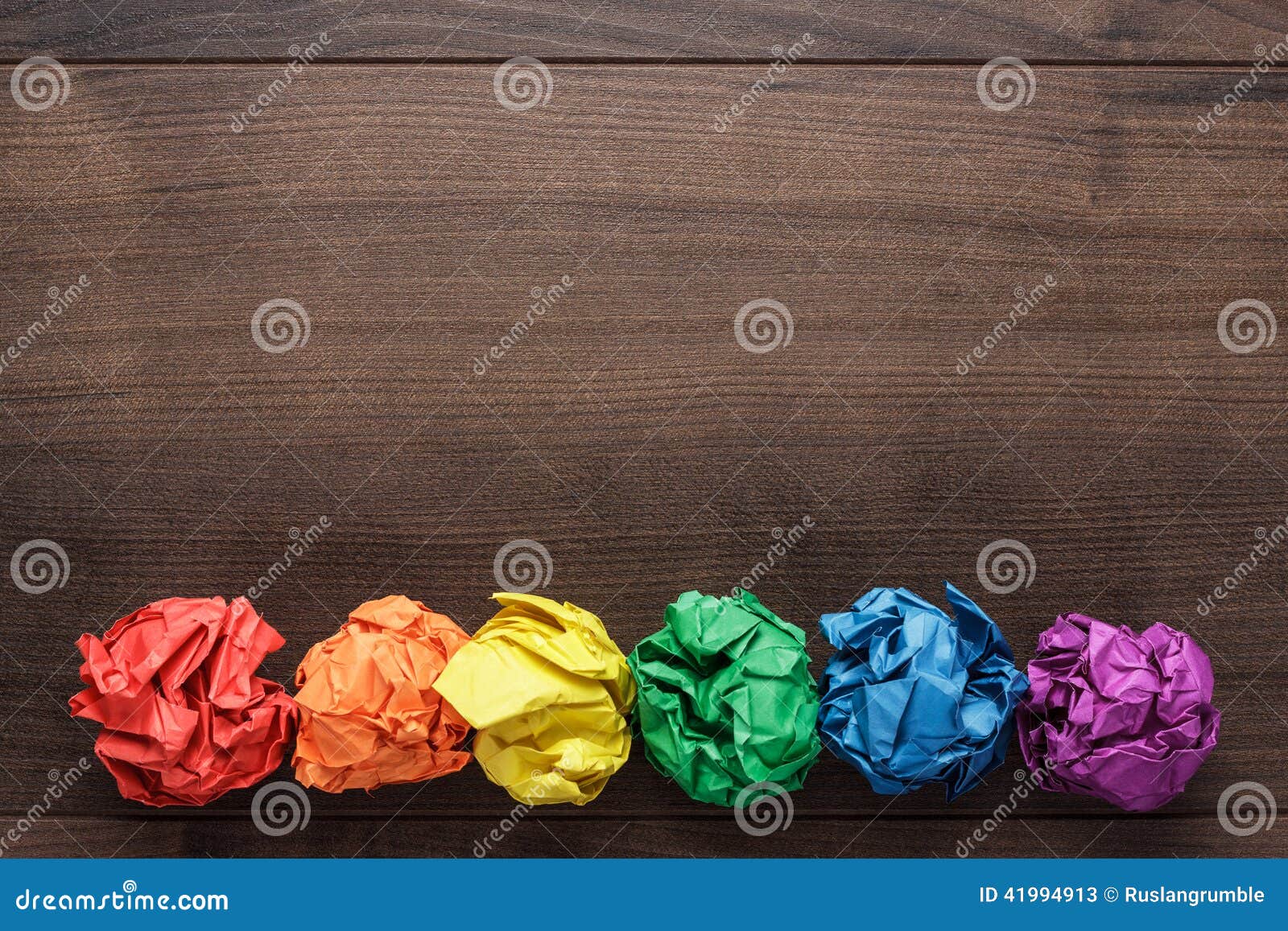 Crumpled Colorful Paper on Wooden Background Stock Image - Image of ...