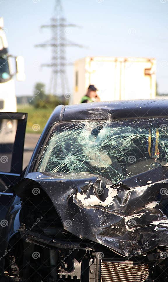 A Crumpled Hood, a Broken Windshield and Deployed Airbags in a Car ...