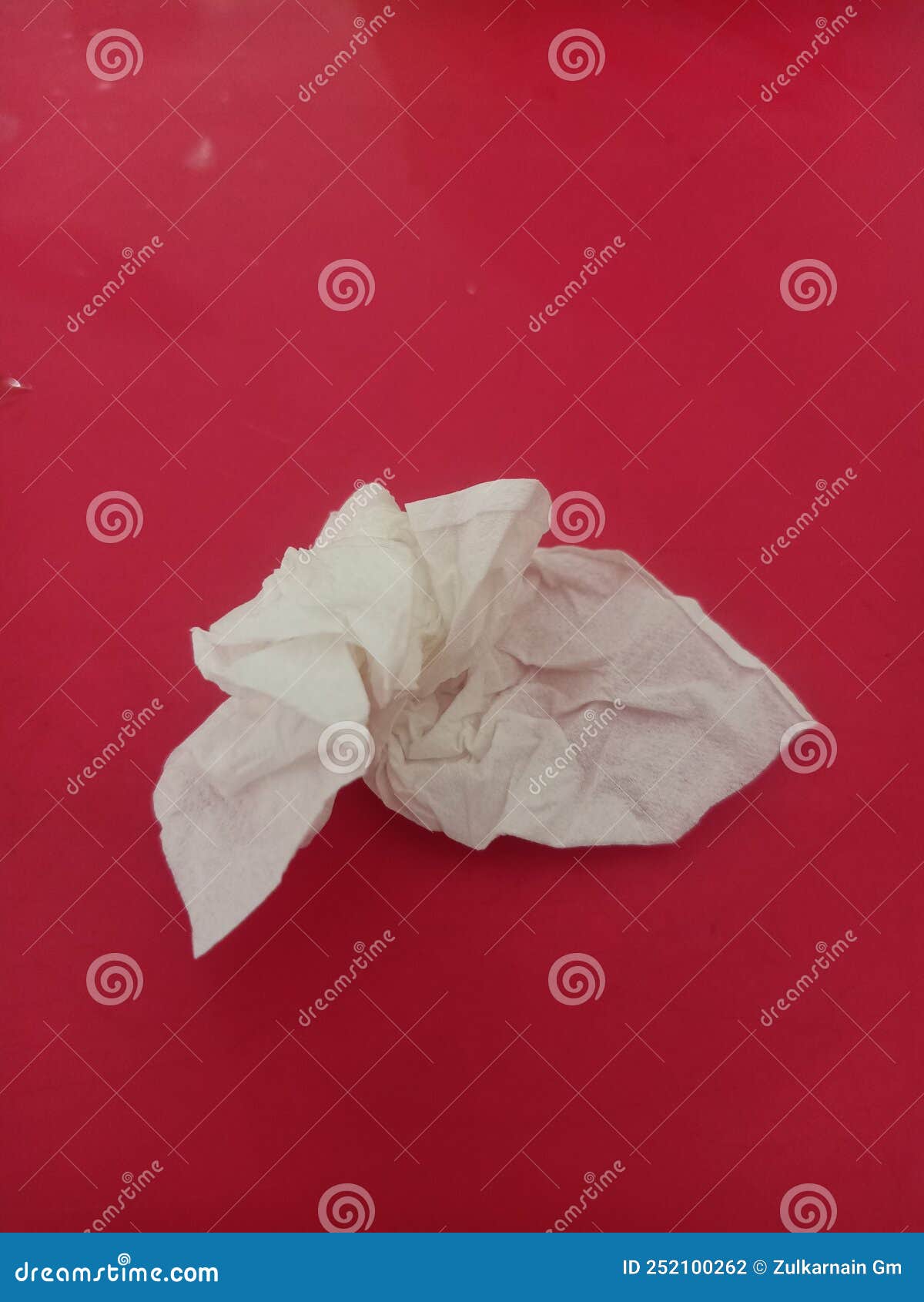 A Crumpled Lump of Tissue on a Red Background Stock Photo - Image of ...