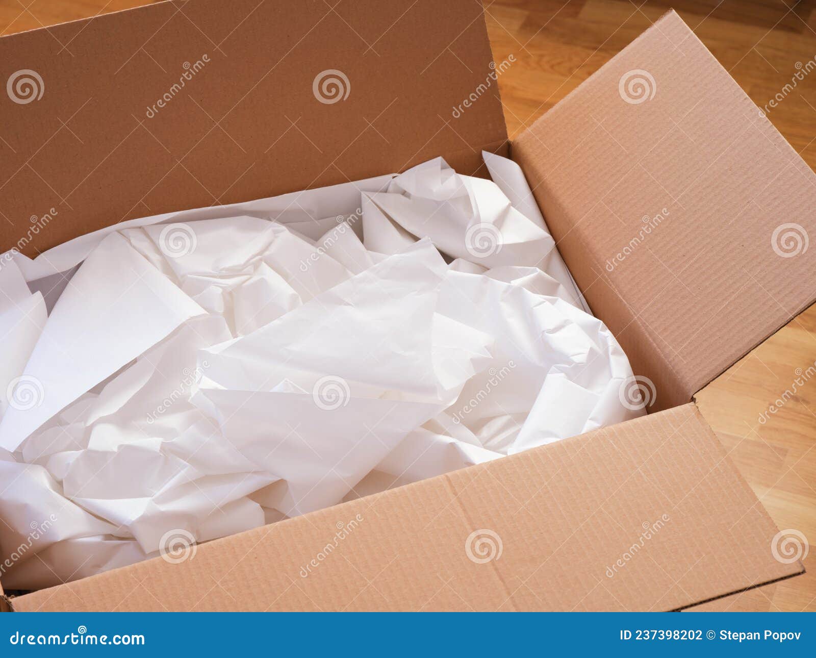 Crumpled Paper in a Cardboard Box Stock Photo - Image of package, pack ...