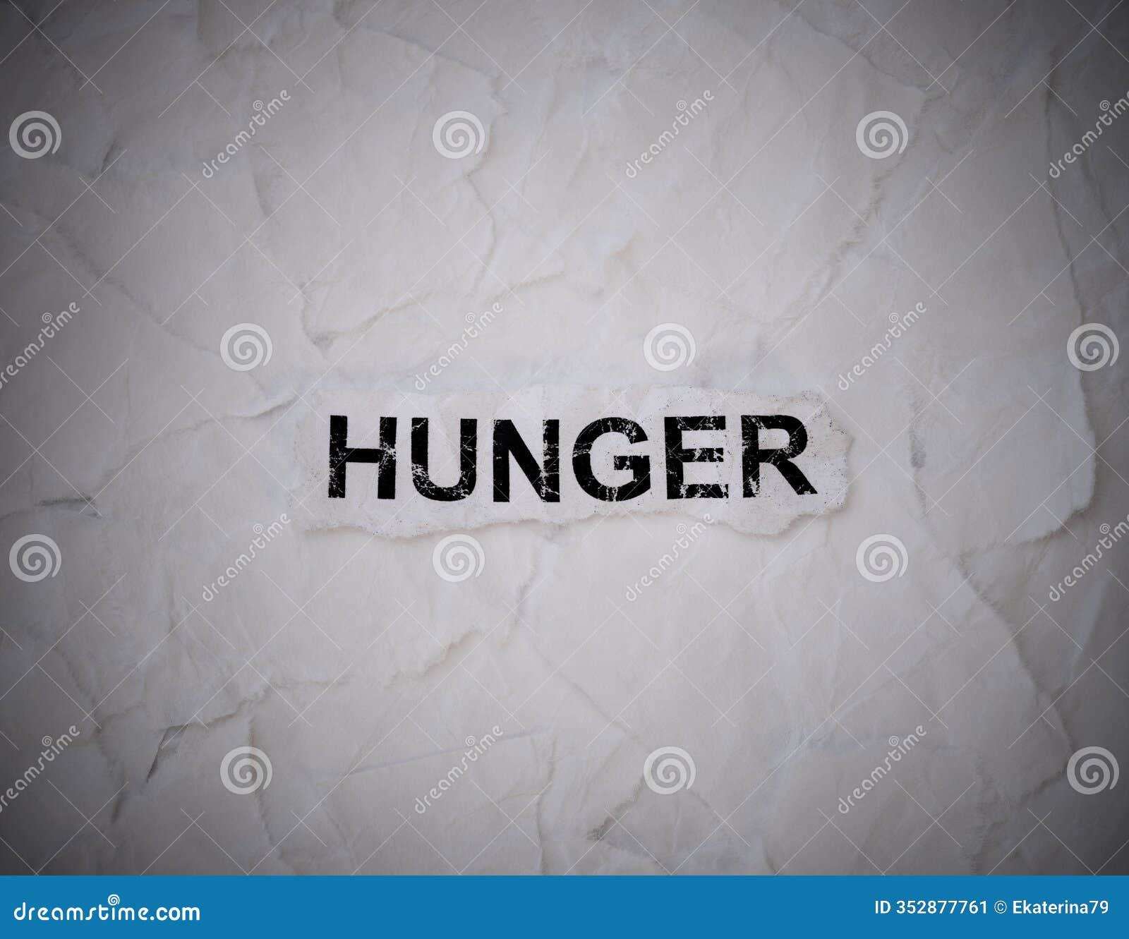Crumpled Piece of Paper with Word Hunger on Torn White Paper Pieces ...