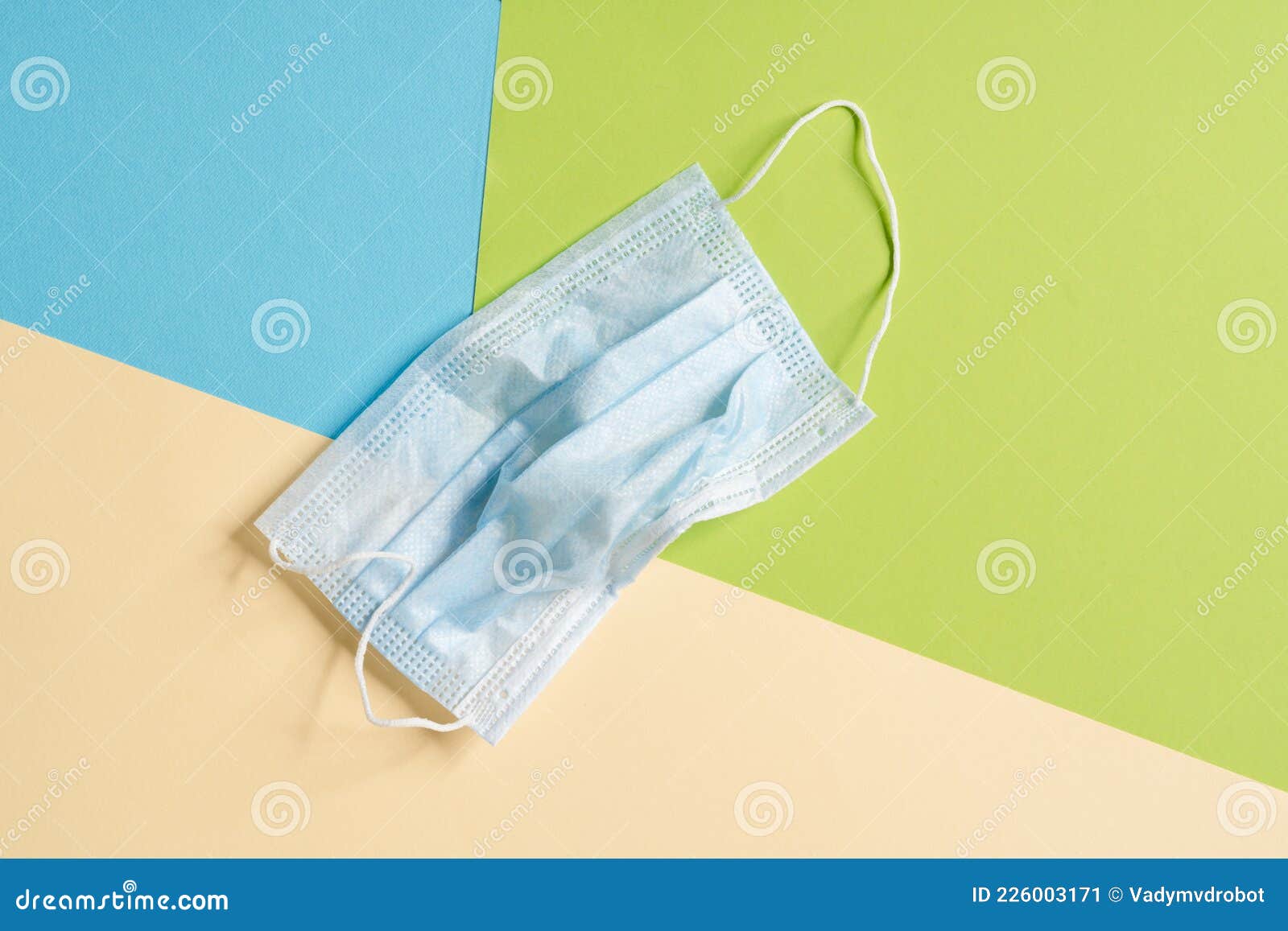 A Crumpled Protective Mask Lying on the Colorful Background Stock Image ...