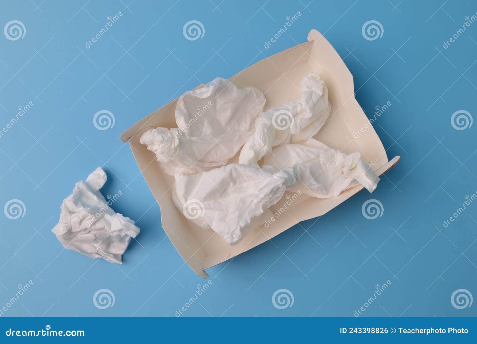 Crumpled Tissues and Paper Box Isolated on a Blue Background Stock ...