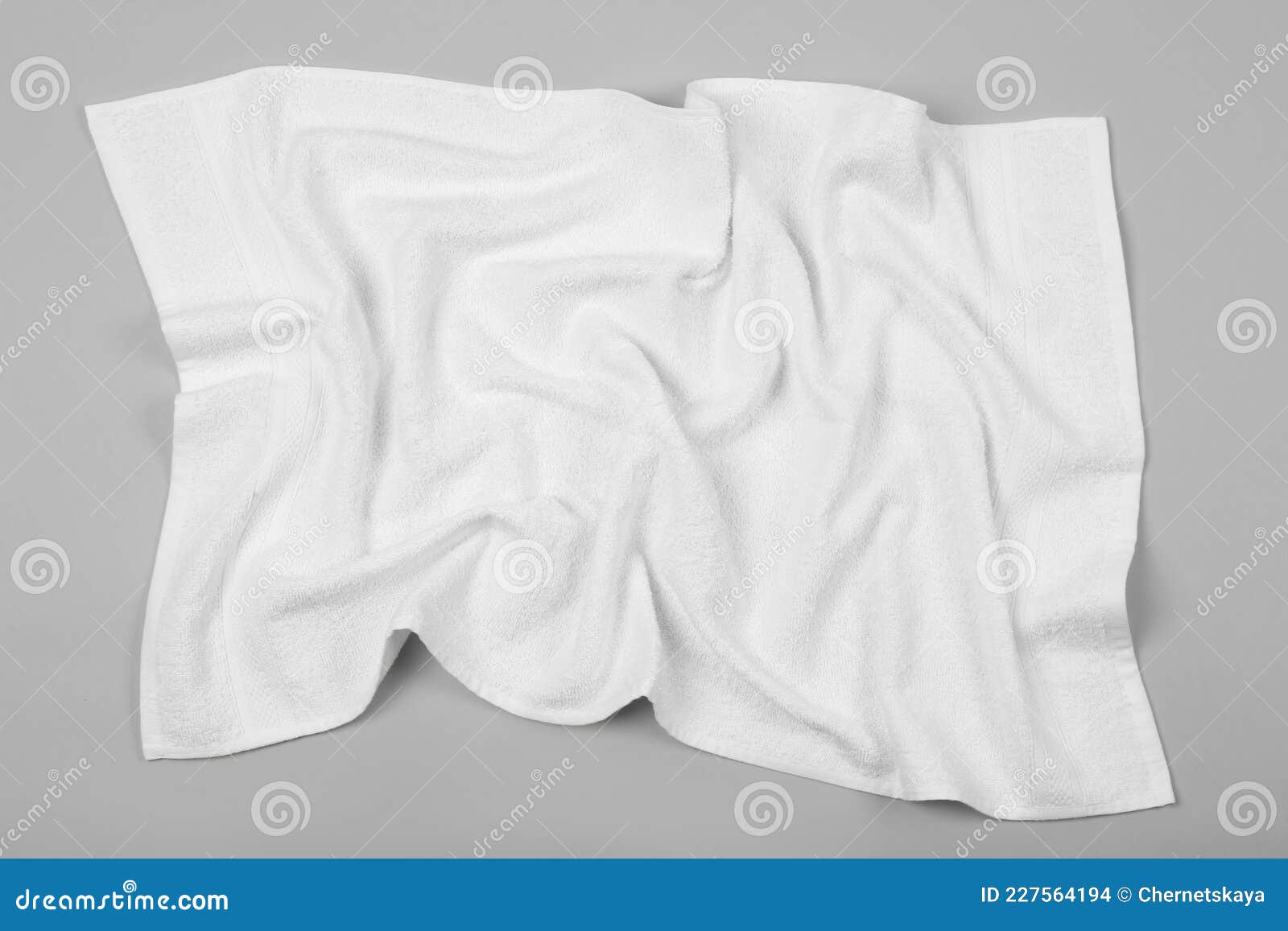 Crumpled White Beach Towel on Light Grey Background, Top View Stock ...