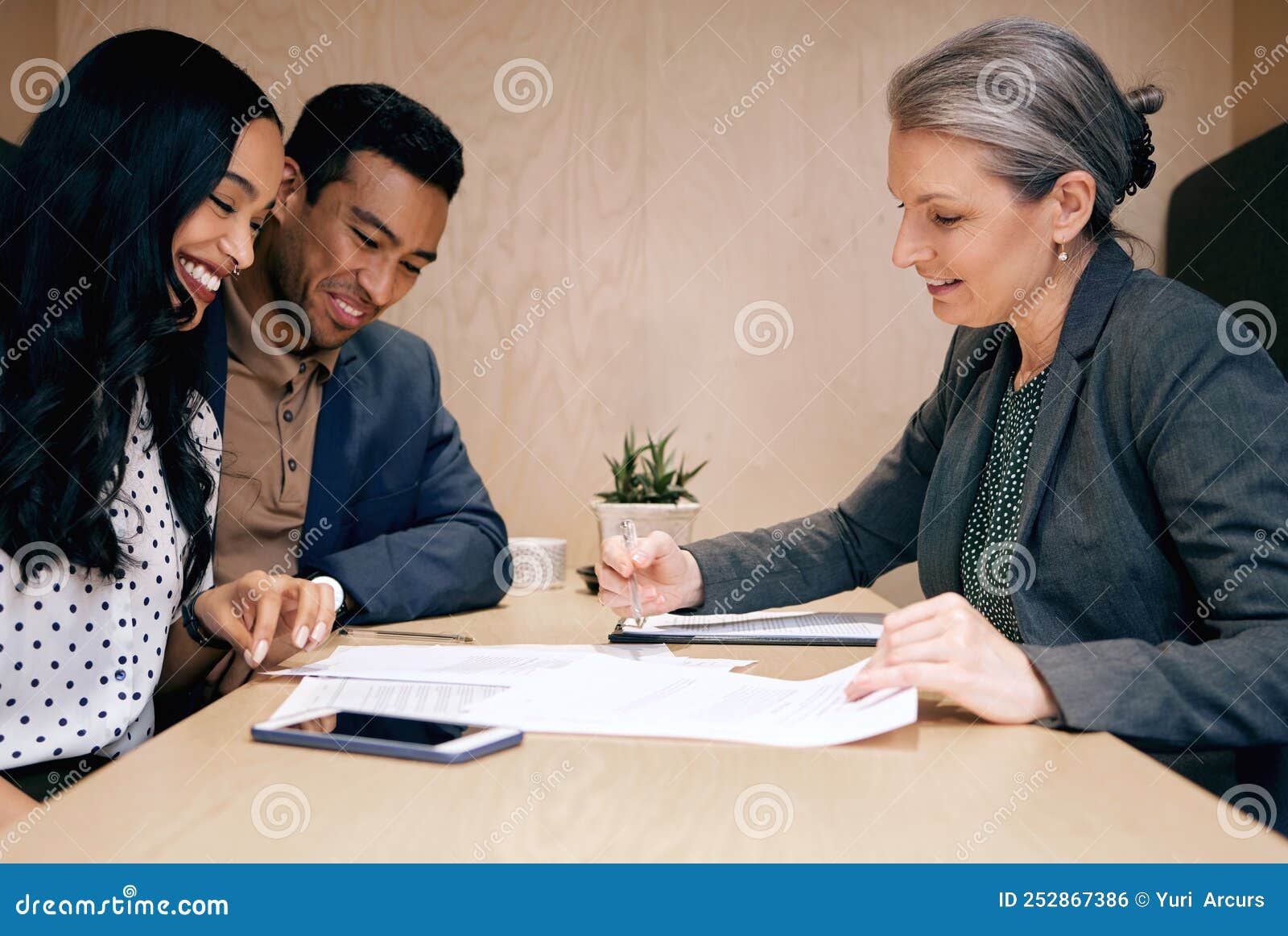 Crunching the Numbers. an Affectionate Young Couple Meeting with Their ... Crunching the Numbers. an Affectionate Young Couple Meeting with Their ...