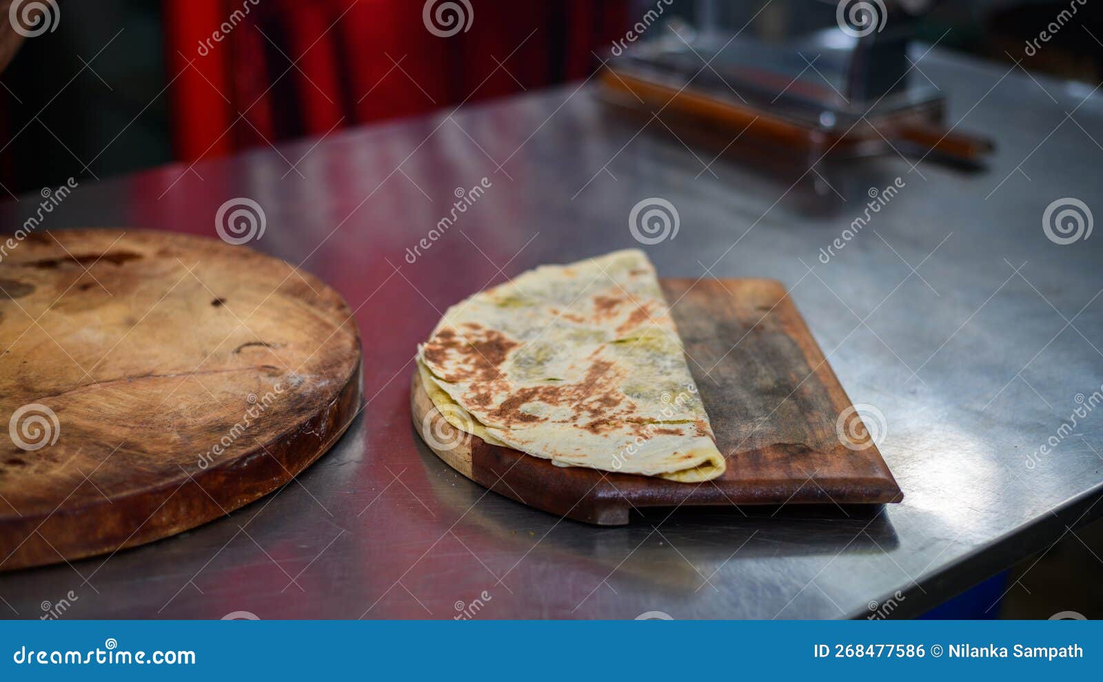 Crunchy Folded Single Tortilla Bread on a Wooden Plate on the Kitchen ...