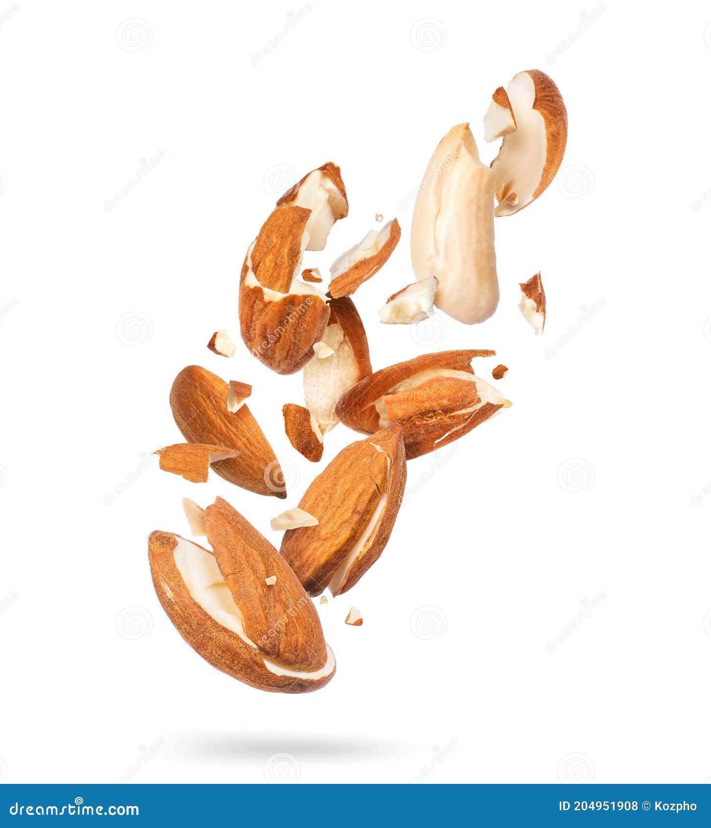 Crushed Almonds in the Air into Many Pieces Isolated on White ...