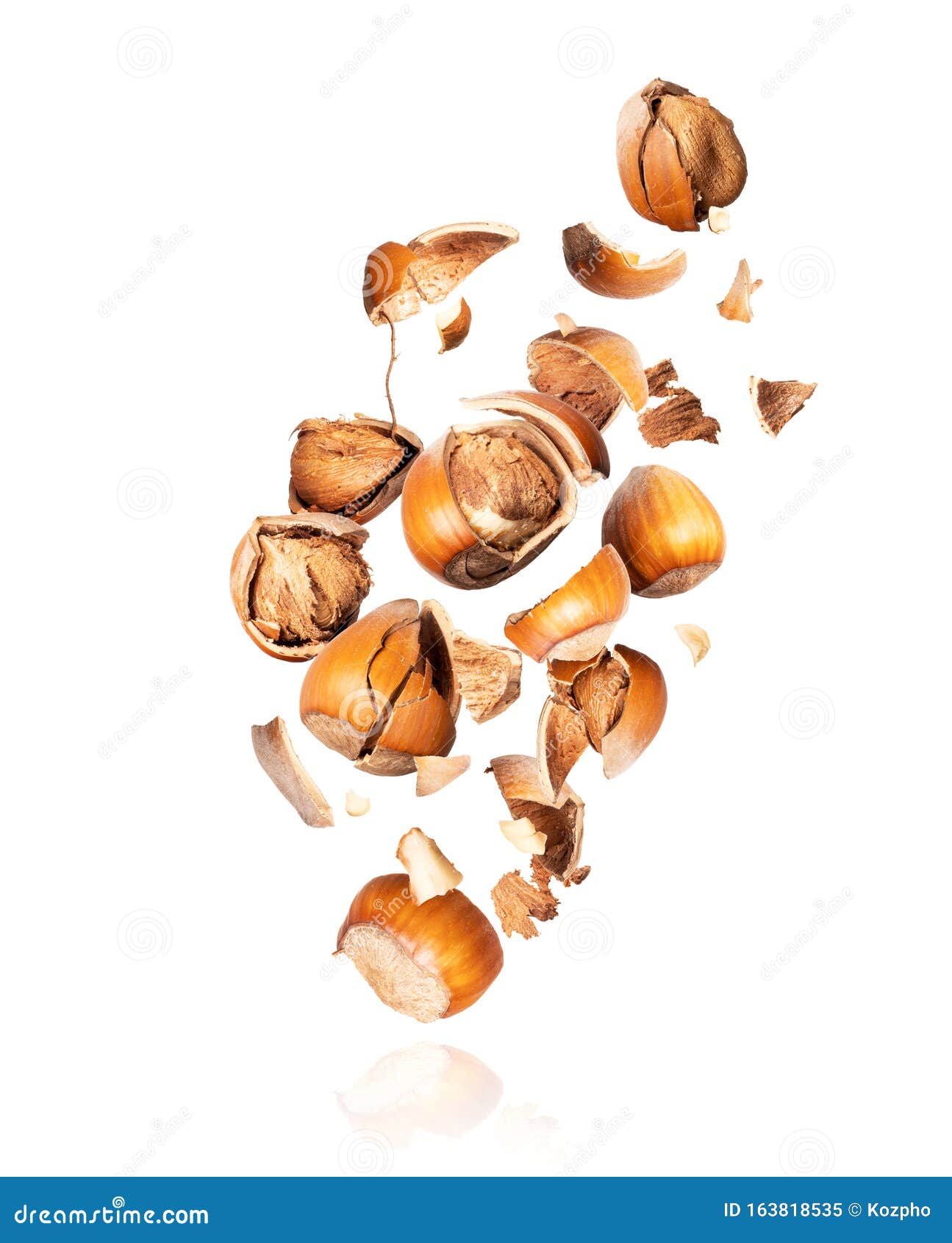 Crushed Hazelnuts Frozen in the Air on a White Background Stock Image ...