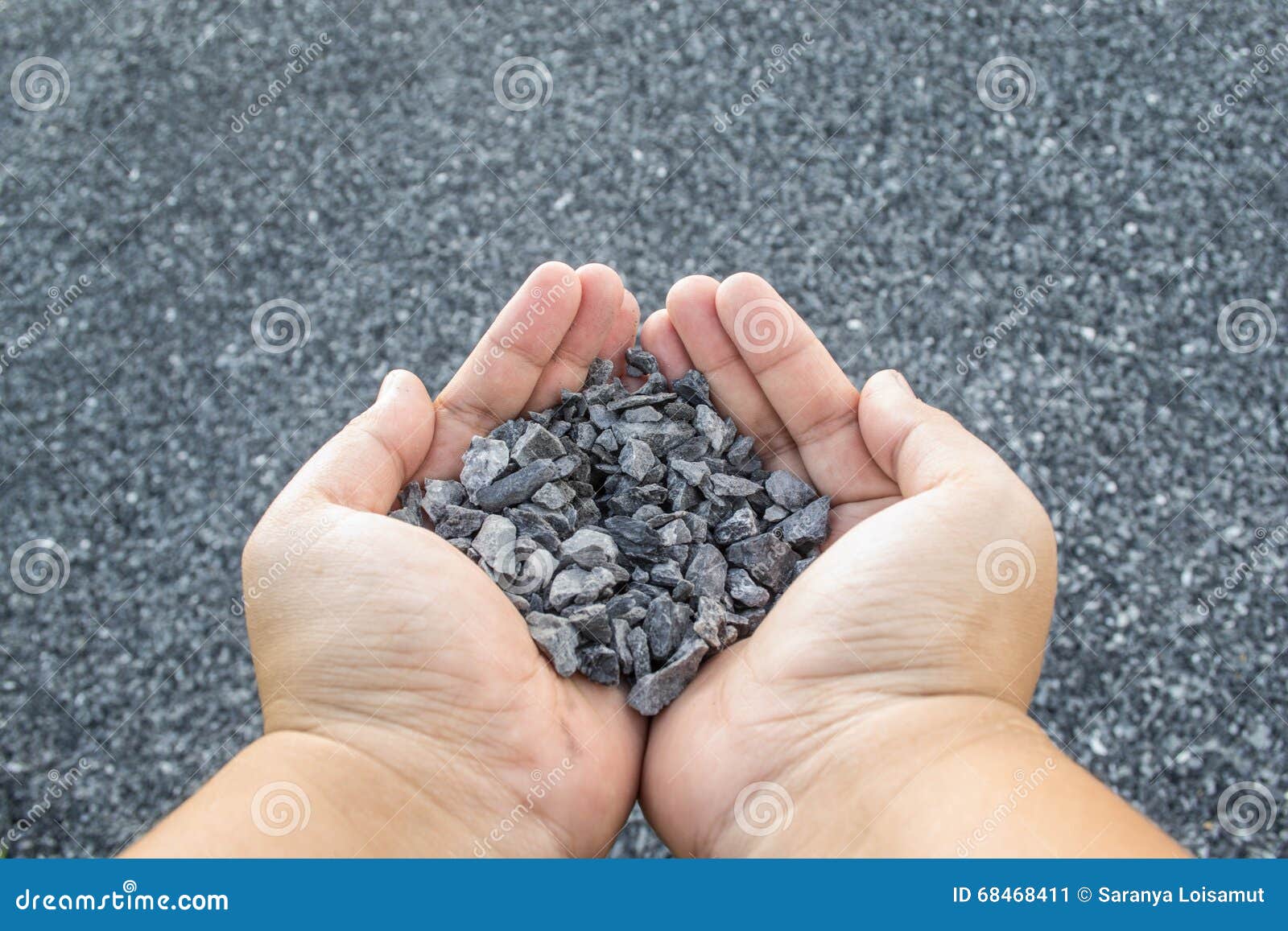 Crushed stone in hand stock image. Image of material - 68468411