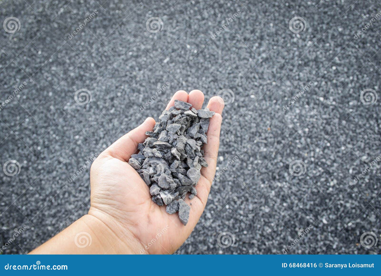 Crushed stone in hand stock photo. Image of concrete - 68468416