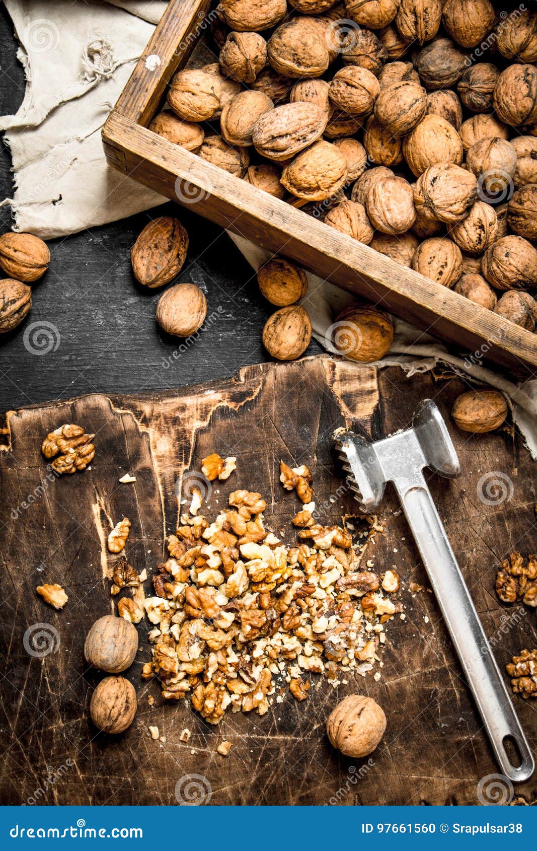 Crushed Walnuts with a Hammer on the Old Board. Stock Photo - Image of ...