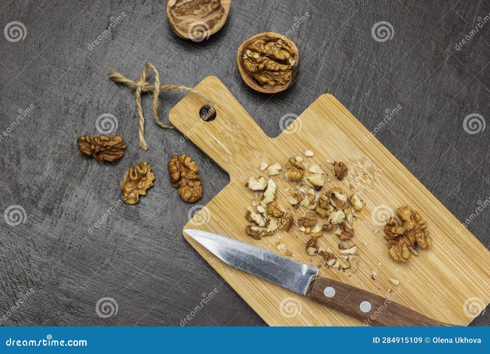 Crushed Walnuts and Knife on Cutting Board. Walnut Shell and Walnut ...