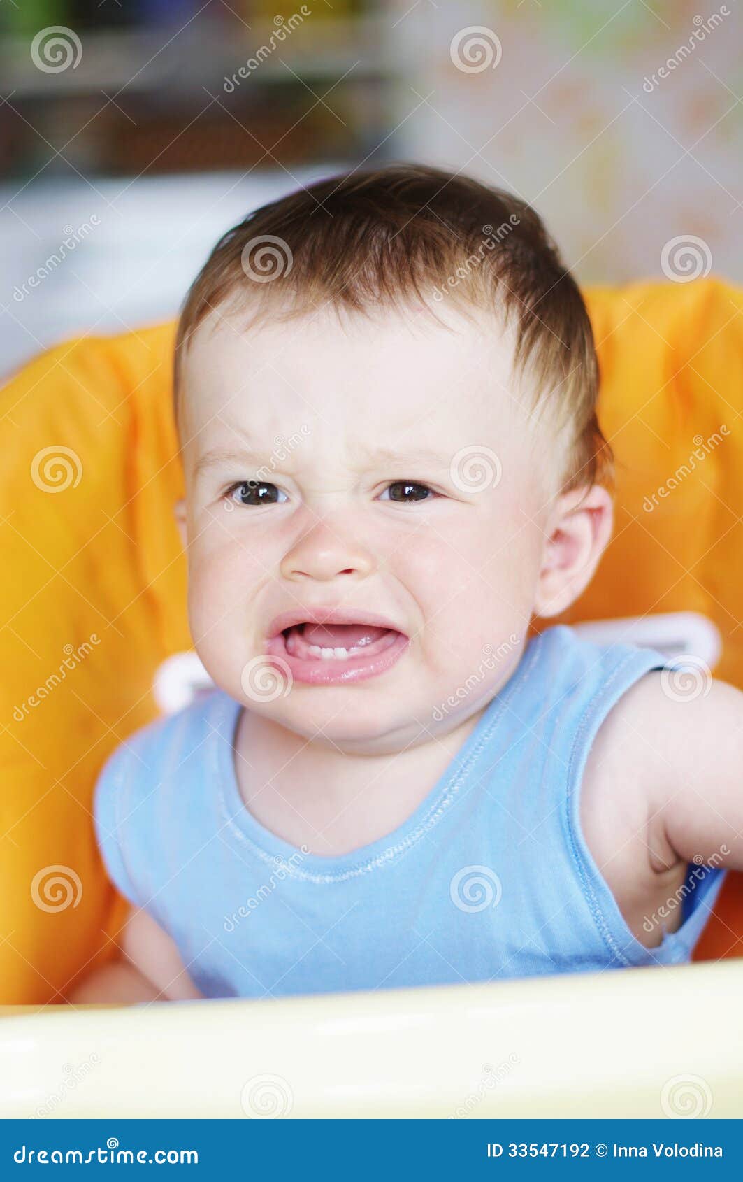 Crying Baby on Orange Chair Stock Photo - Image of offense, stool: 33547192