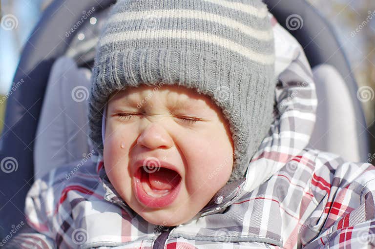 Crying baby outdoors stock image. Image of carriage, year - 34963109
