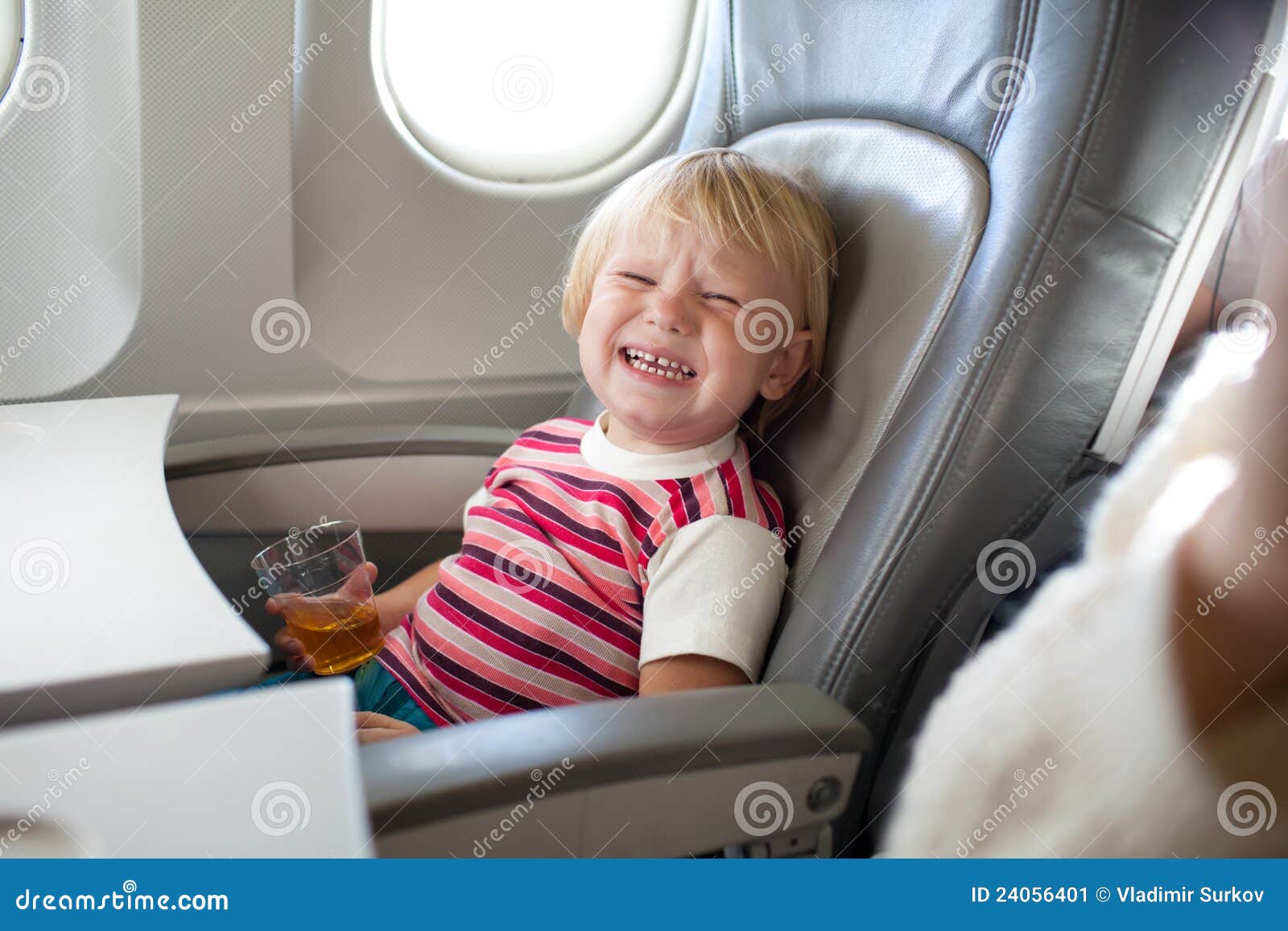 Crying child in airplane stock image. Image of arrivals - 24056401