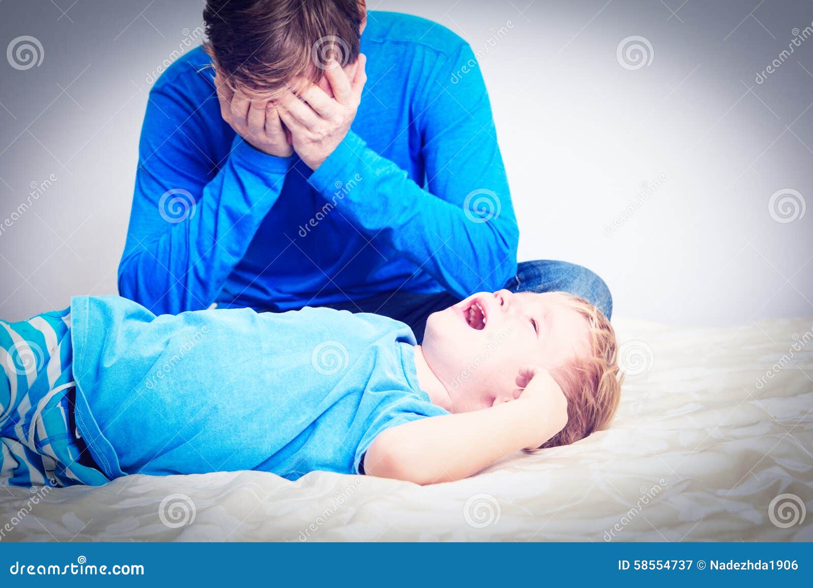 Crying child, tired father stock image. Image of adult - 58554737