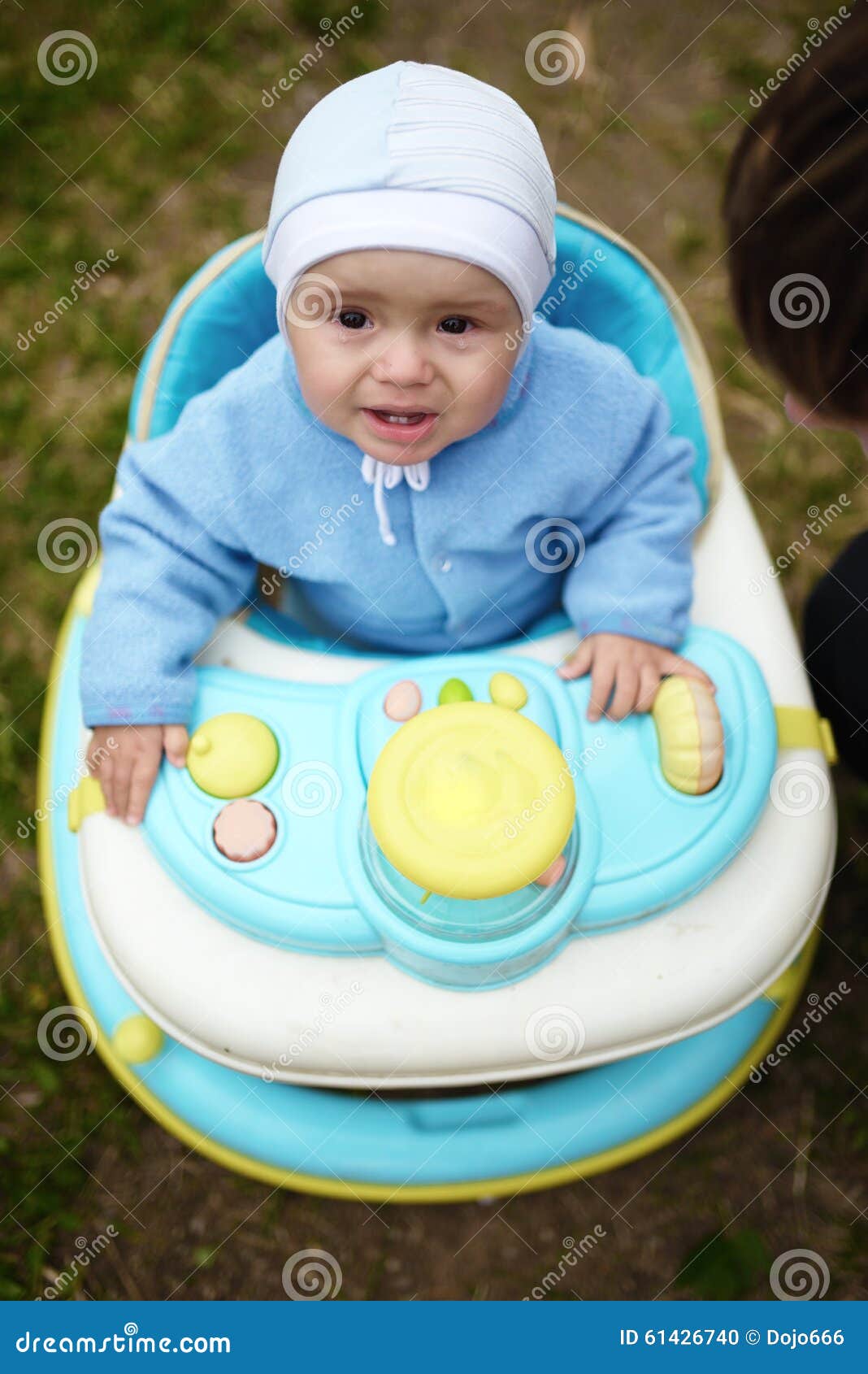 Crying Cute Baby in Baby Walker Walks Outdoors Stock Photo - Image of ...