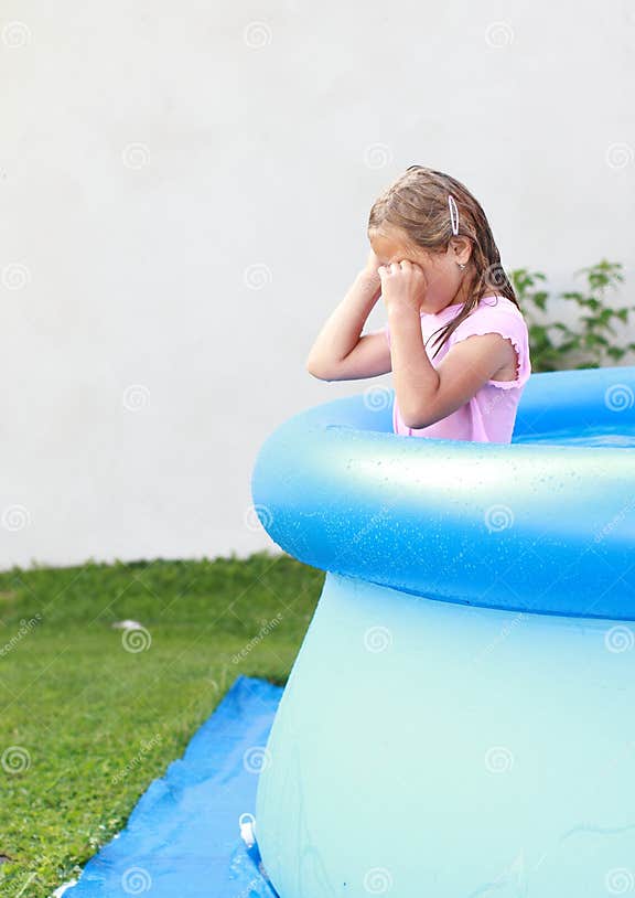 Crying girl in pool stock photo. Image of standing, walking - 25492420