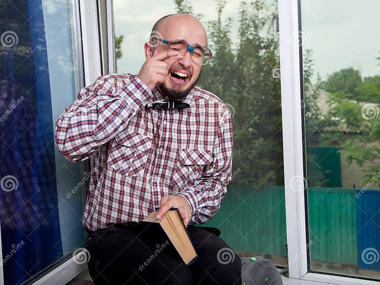 Crying nerd reading a book stock image. Image of people - 56388765