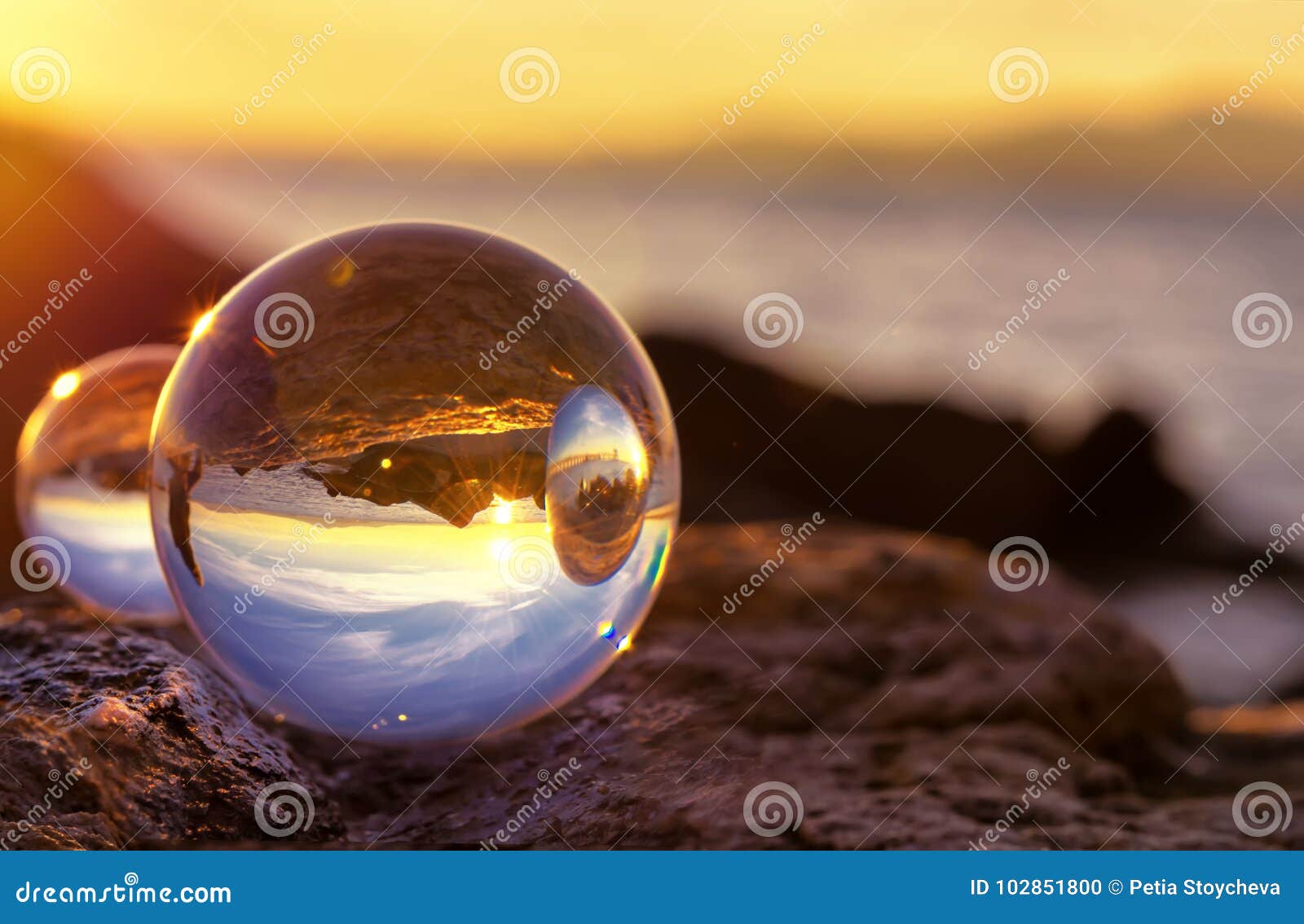 Crystal Ball Reflection on the Seashore in Sunrise Light. Mirror ...