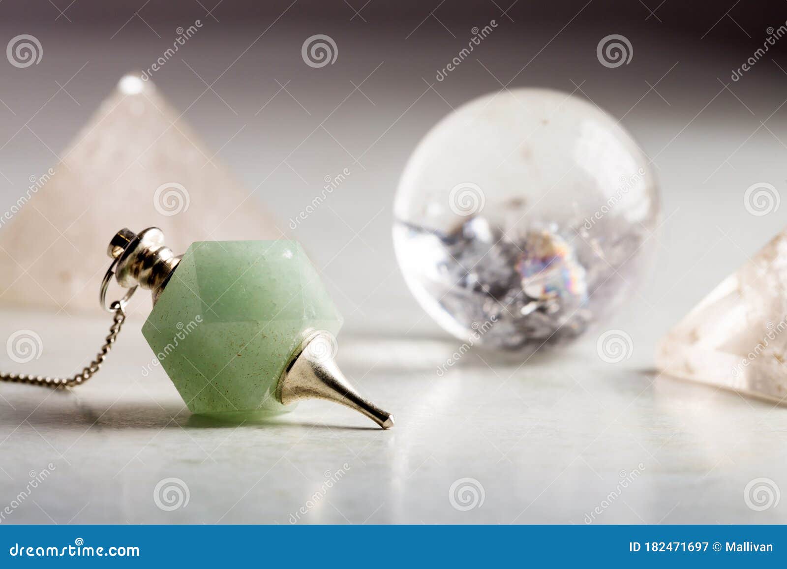 Crystal Ball, Rock Crystal Pyramid and Pendulum Stock Image - Image of ...