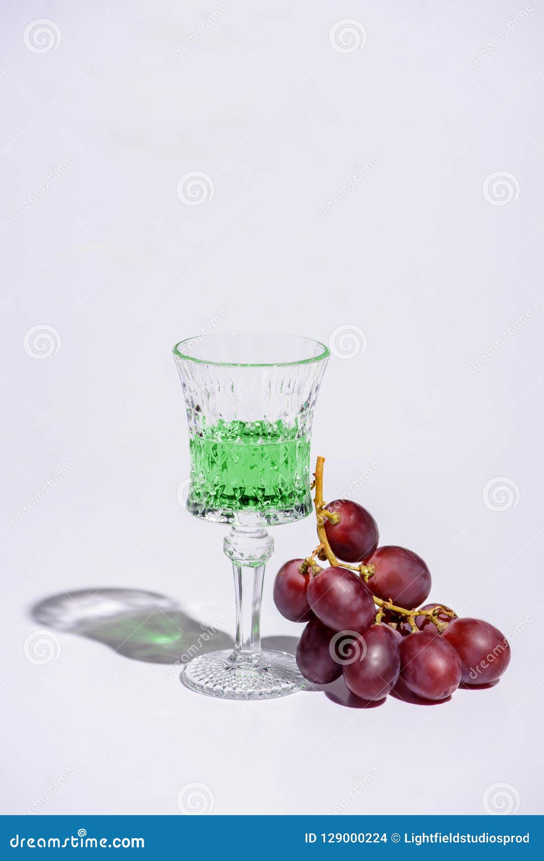 Crystal Glass of Absinthe with Branch of Grapes Stock Photo - Image of ...