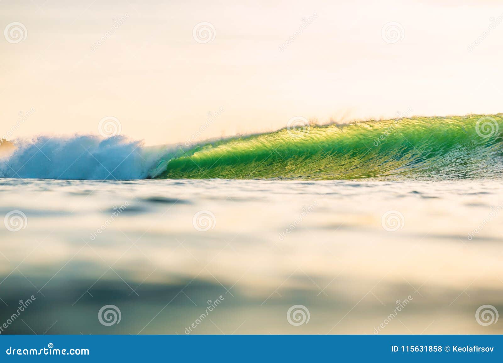 Crystal Green Wave in Ocean. Breaking Wave and Evening Light Stock ...