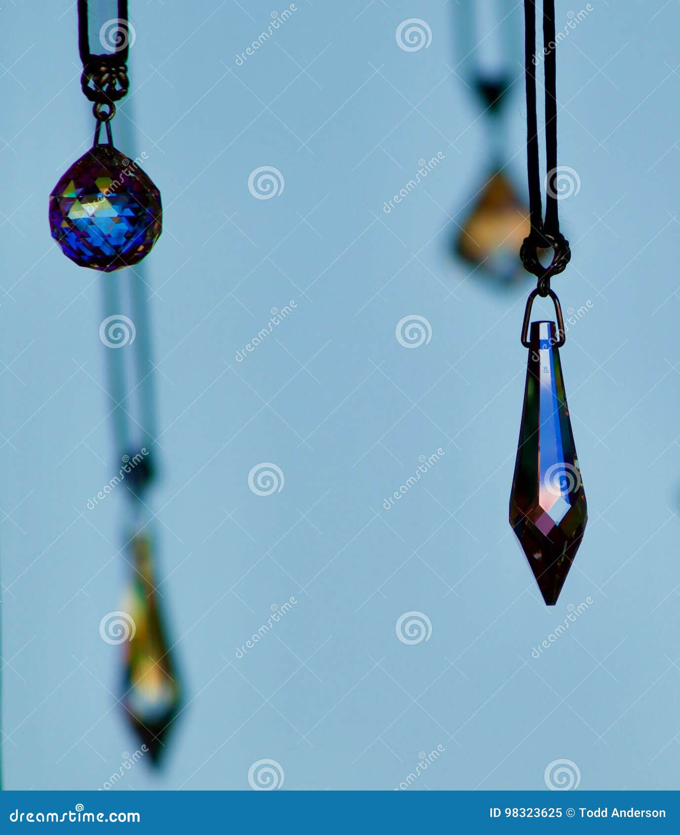 Crystal Pendents Hanging with a Blue Background Stock Image - Image of ...