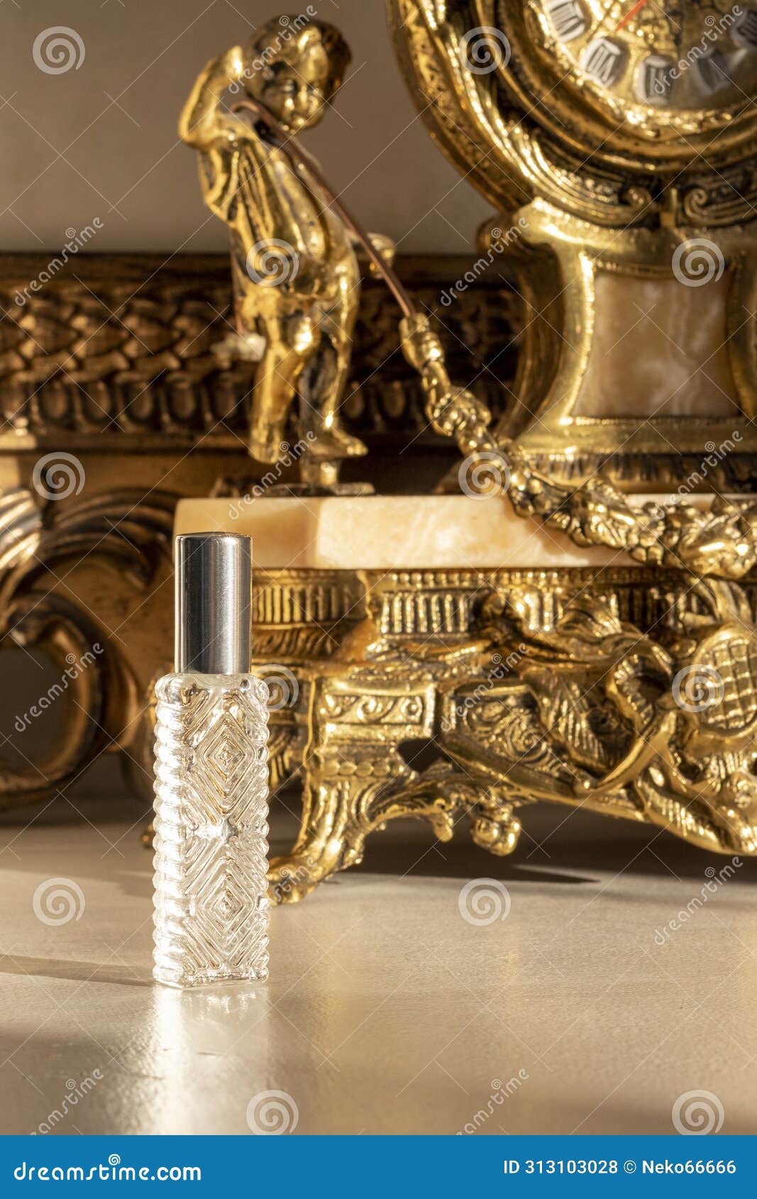 Crystal Perfume Bottle on the Background of a Gold Watch Stock Photo ...