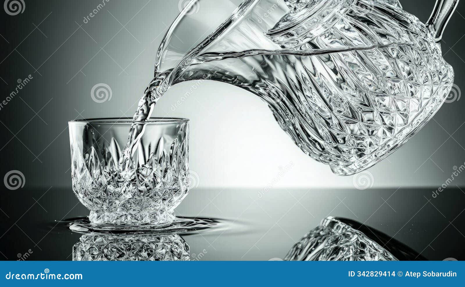 Crystal Pitcher Pouring Water into a Glass on a Reflective Surface ...