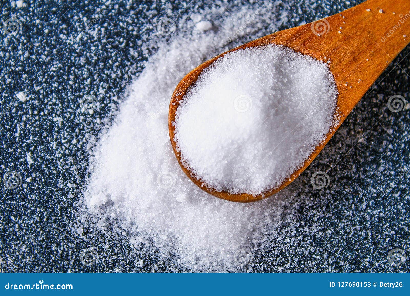 Crystals of Shallow Salt in a Scoop, Spoon on a Dark Gray Table. Stock ...