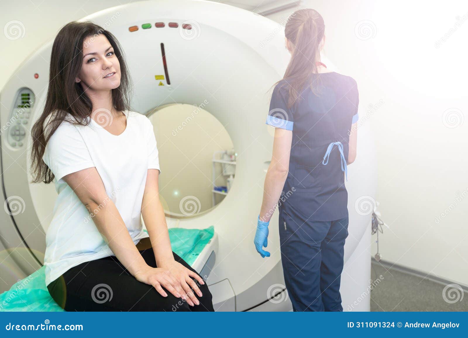 CT Scan Technologist Overlooking Patient in Computed Tomography Scanner ...