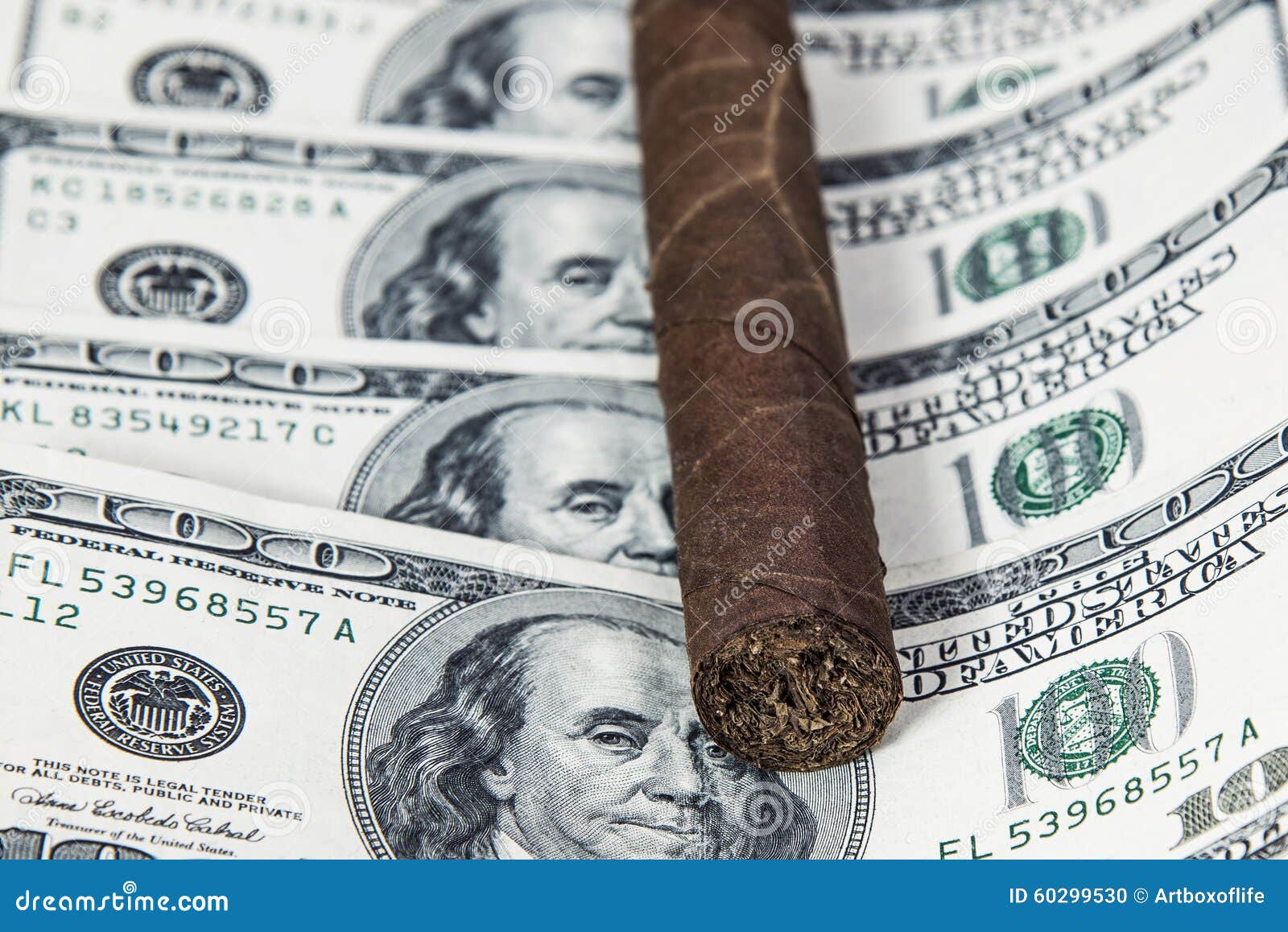 Cuban cigar on the Dollars stock photo. Image of greed - 60299530
