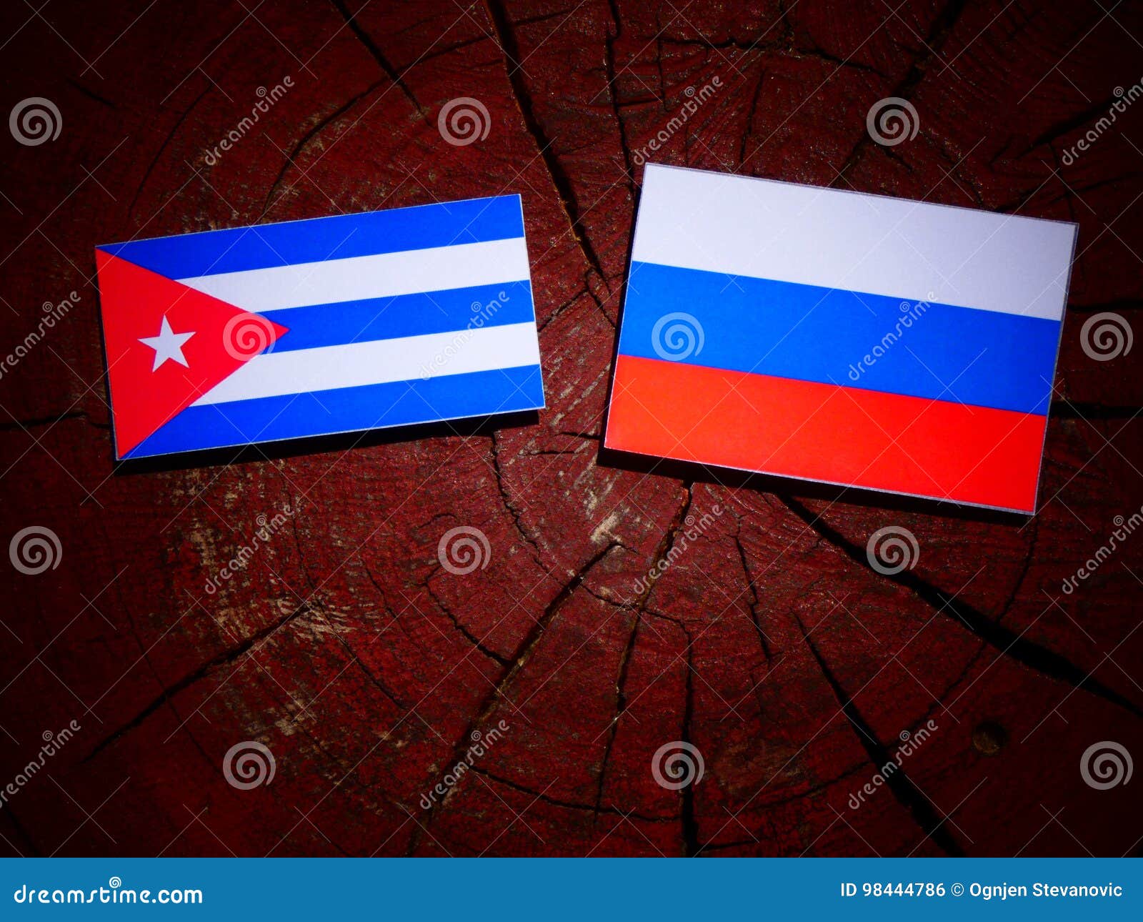 Cuban Flag with Russian Flag on a Tree Stump Stock Photo - Image of ...