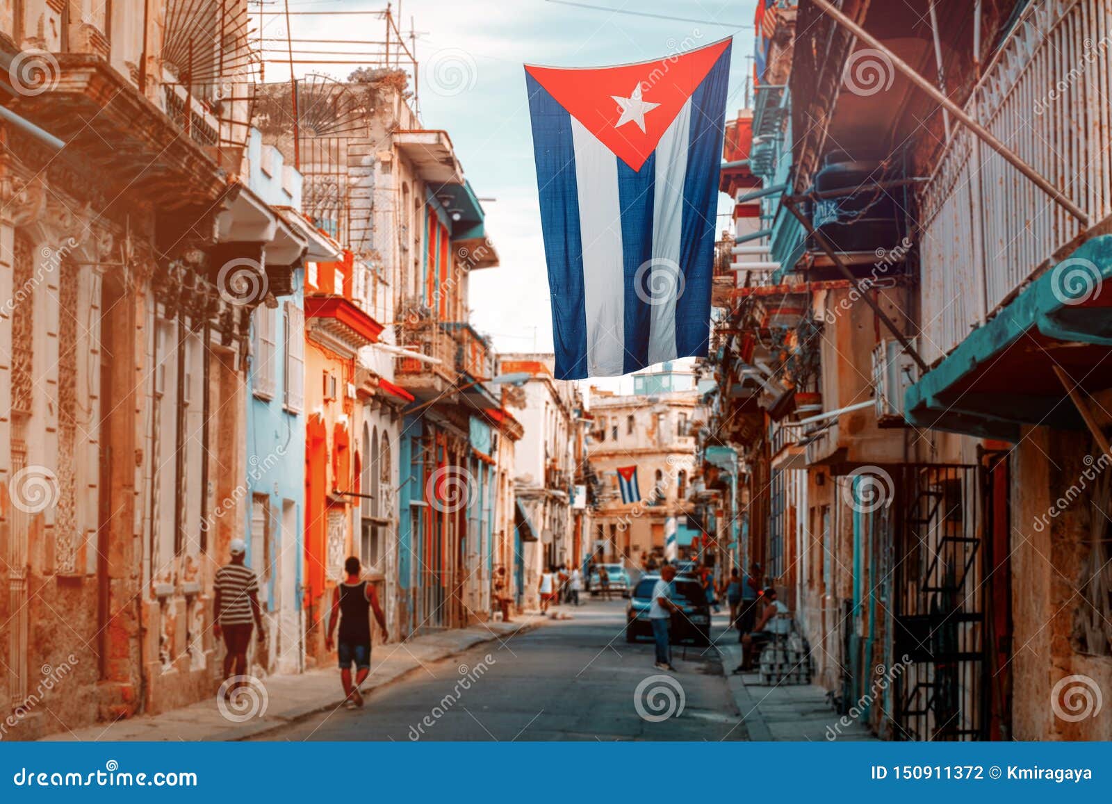 Cuban Flags, People and Aged Buildings in Old Havana Editorial ...
