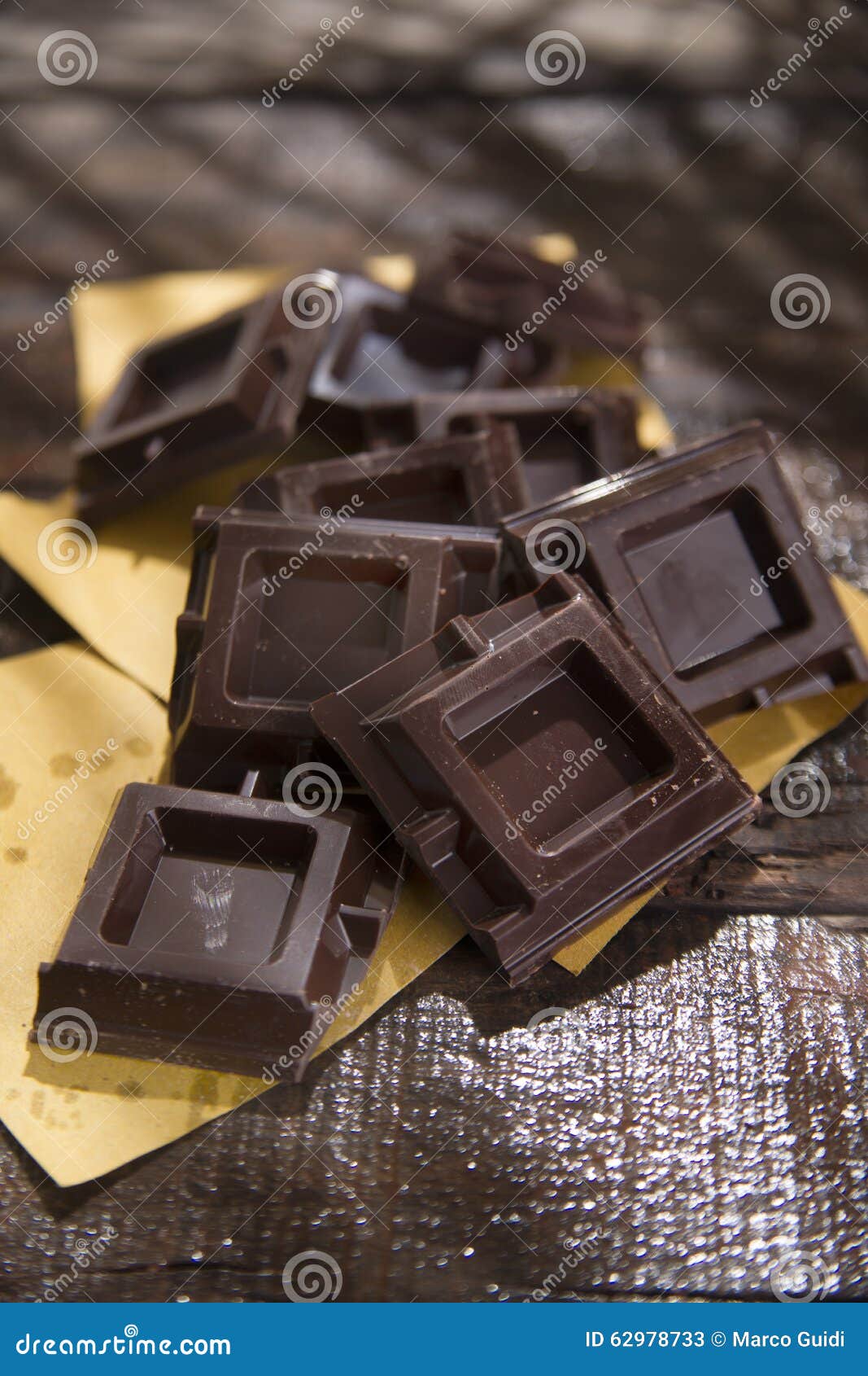 Cubes of dark chocolate stock image. Image of chocolate - 62978733