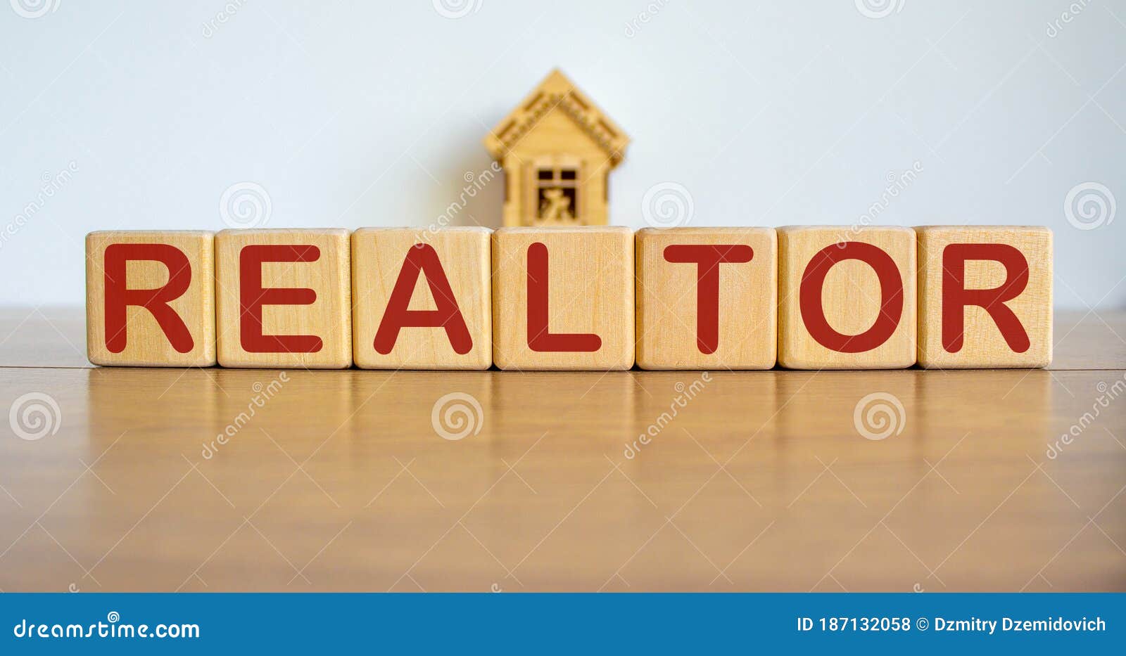 Cubes Form the Word Realtor in Front of a Miniature House Stock Photo ...