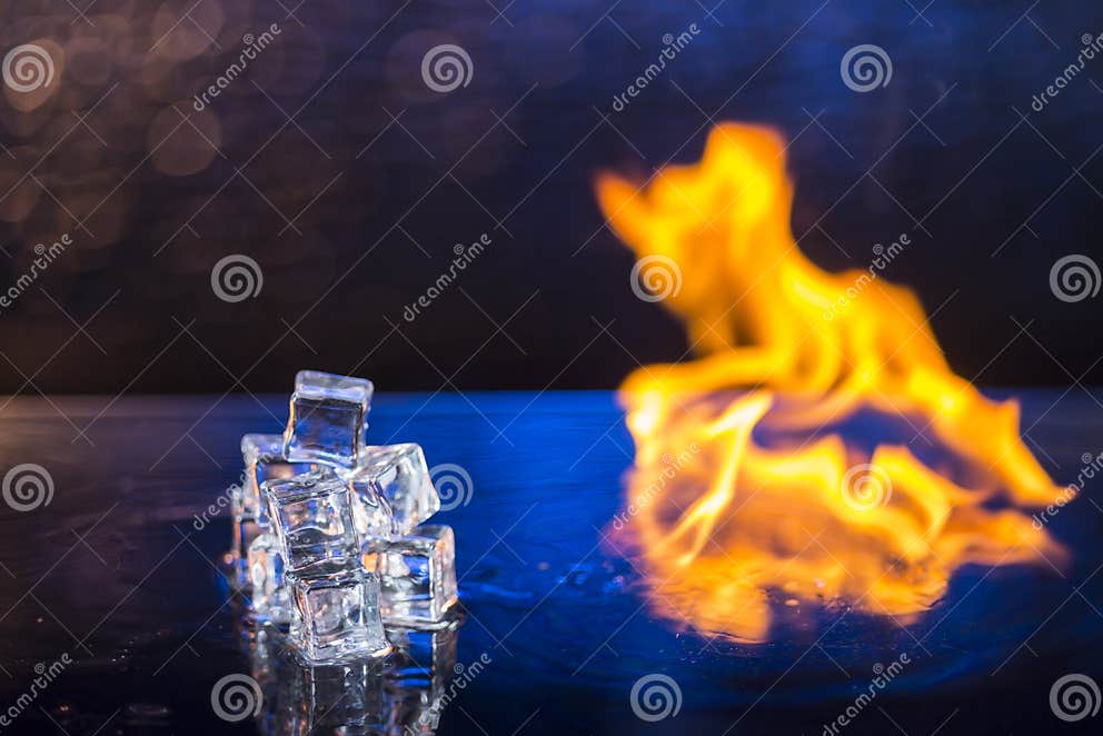 Cubes of Ice and Fire on a Water Surface on an Abstract Background ...