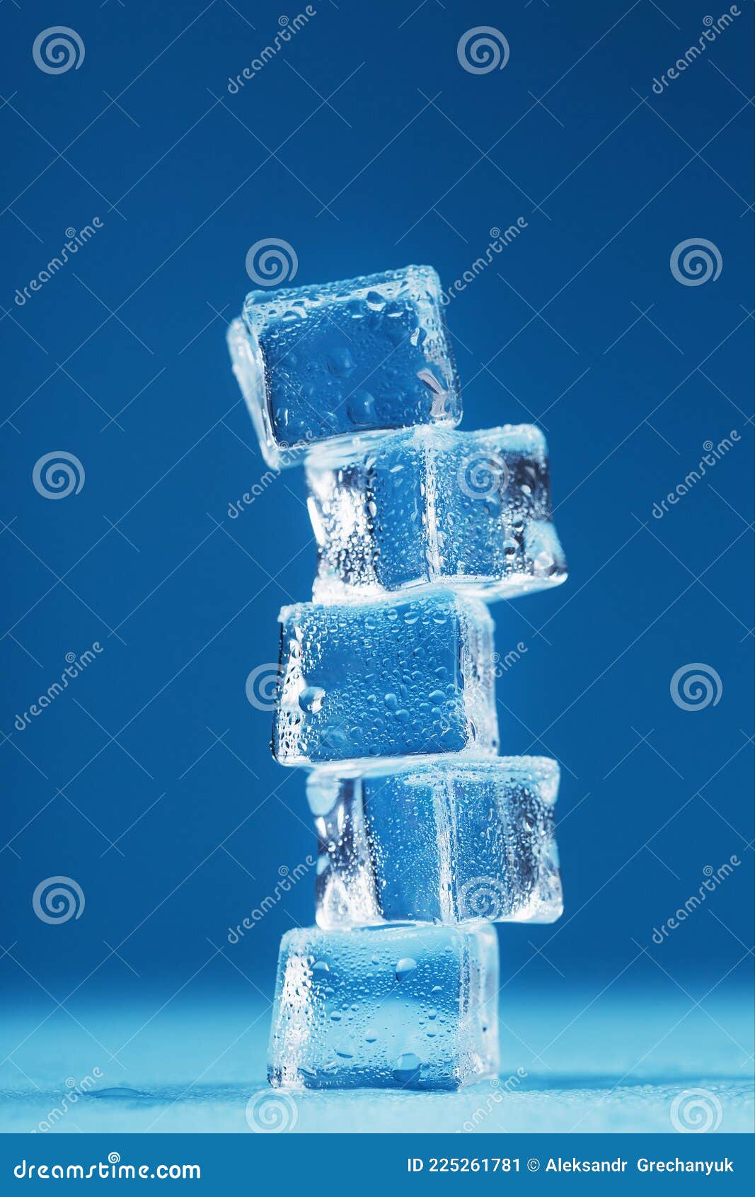 Cubes of Melting Ice Tower on a Blue Background. Stock Image - Image of ...