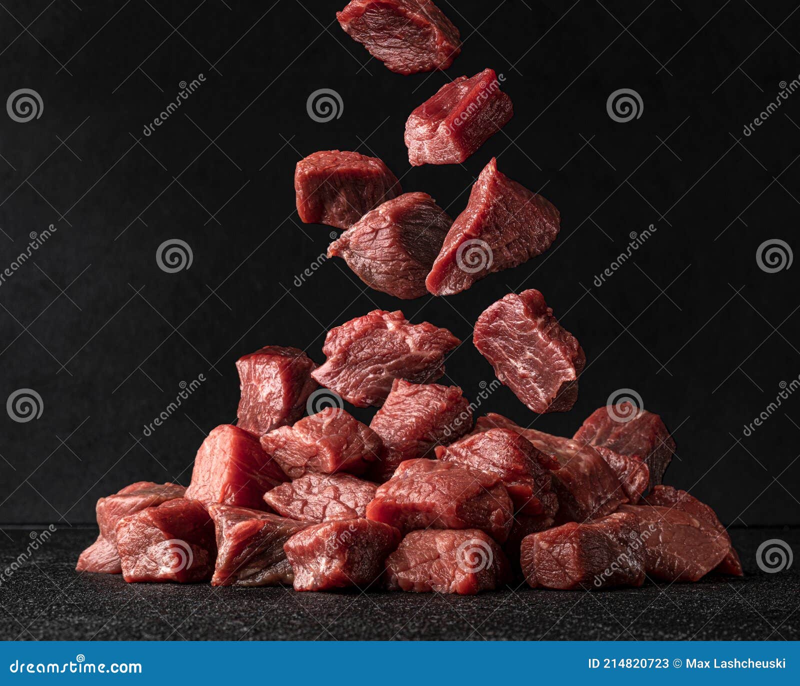 Cubes of Raw Beef Falling Over Black Background Stock Image - Image of ...