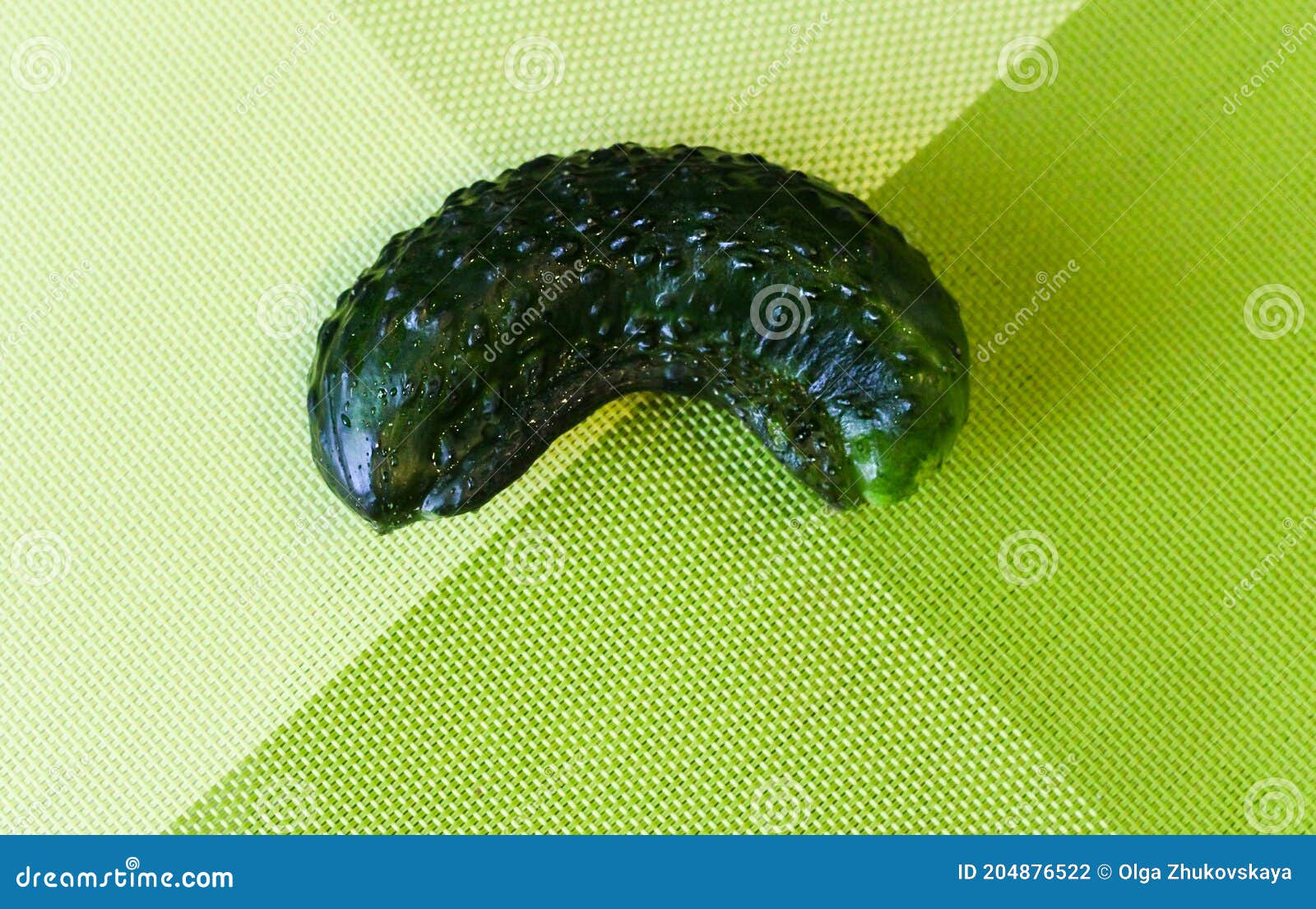 Cucumber on a Green Background. Vegetarian Food Stock Photo - Image of ...