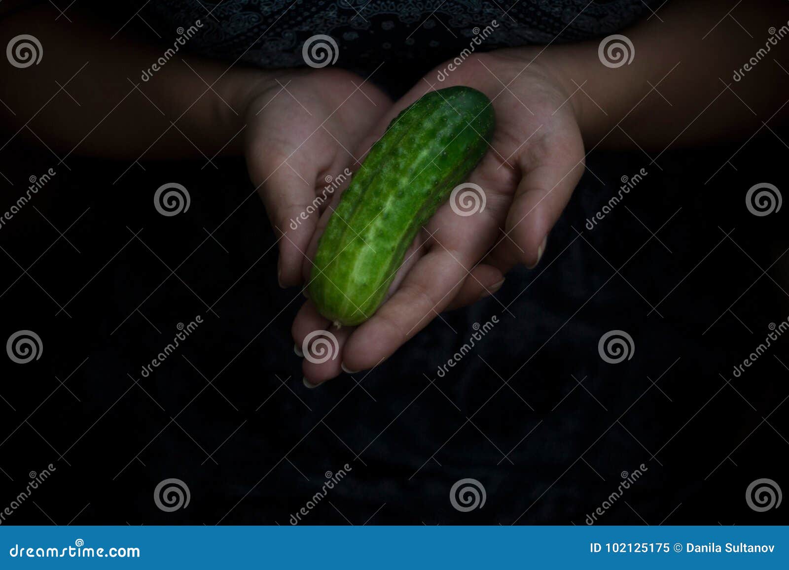 Cucumber in hand stock image. Image of light, cucumber - 102125175