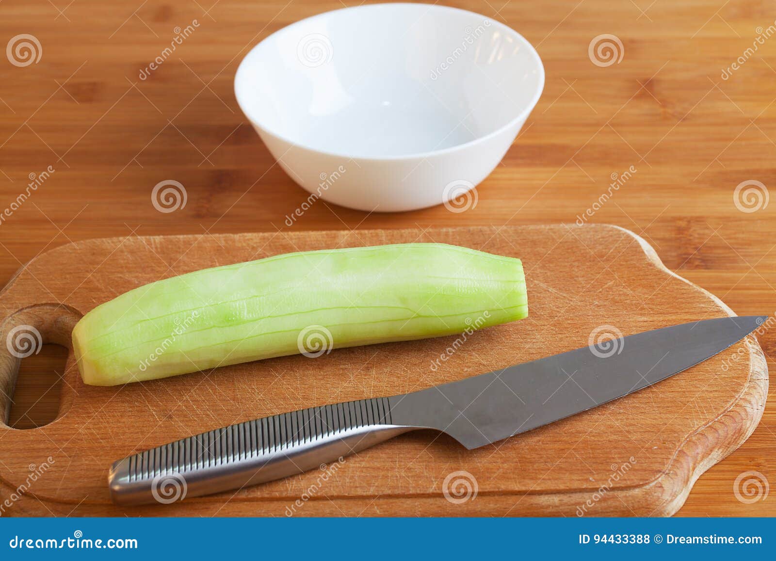 Cucumber, Plate and Knife on a Cutting Board. Stock Photo - Image of ...