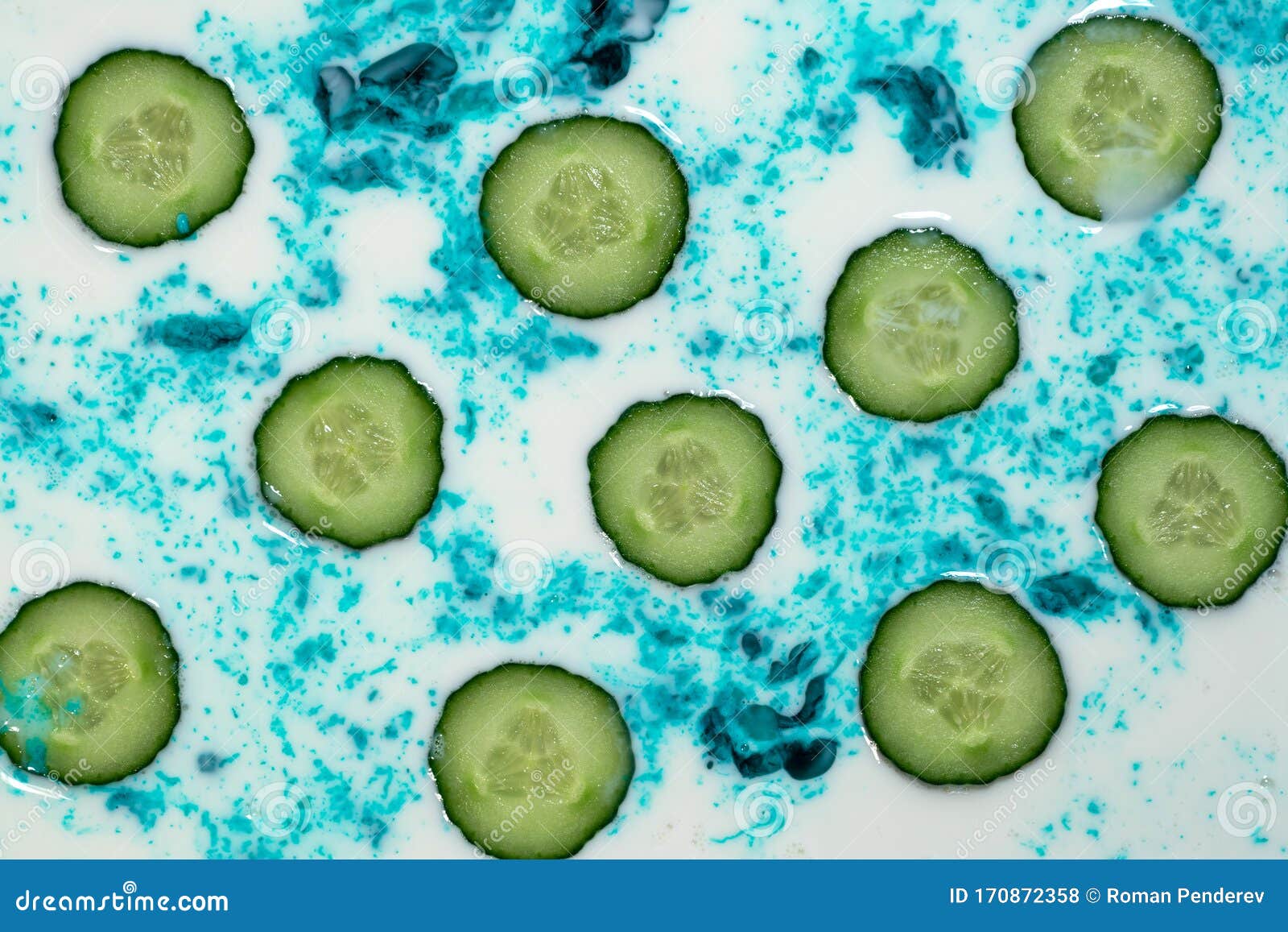 Cucumber Slices on a White and Blue Milk Background Stock Photo - Image ...