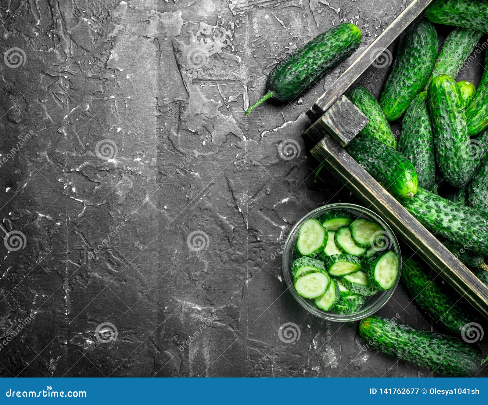Cucumbers in the Box and Cucumber Slices in the Bowl Stock Image ...