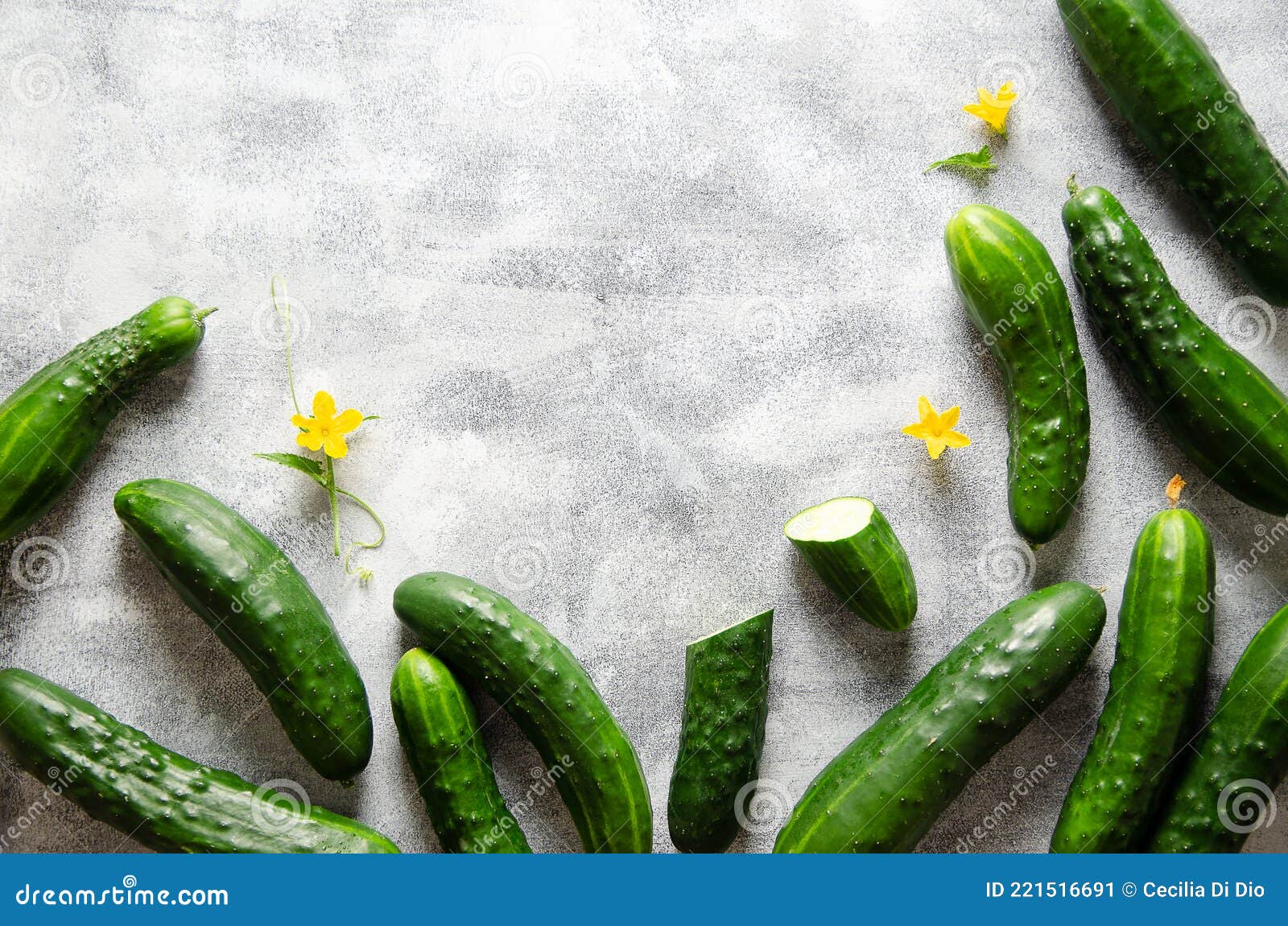 Cucumbers and Cucumber Flowers on a Grey Backdrop. Stock Image - Image ...