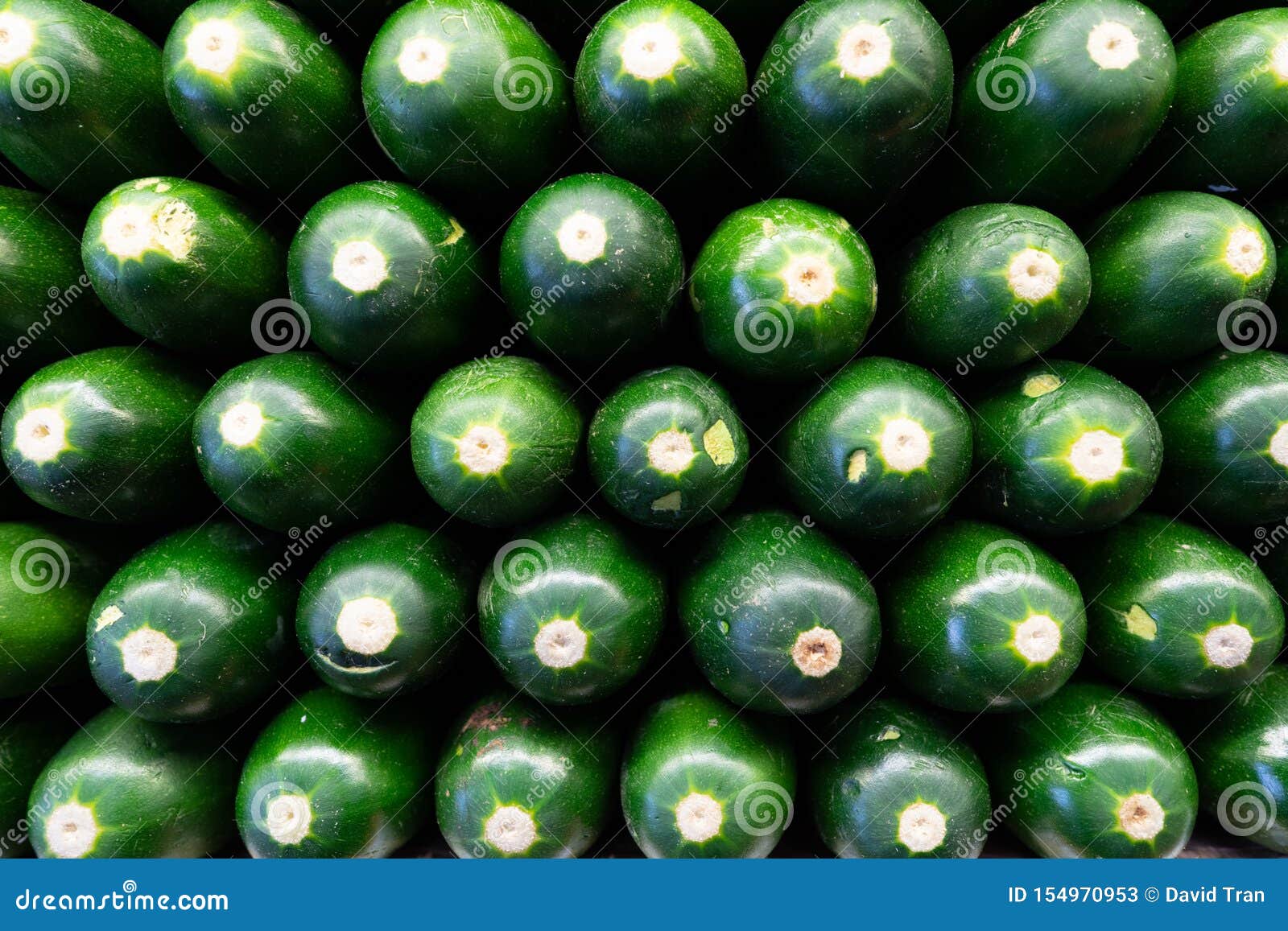 Cucumbers in a Stack in Produce Section of Grocery Store Stock Image ...