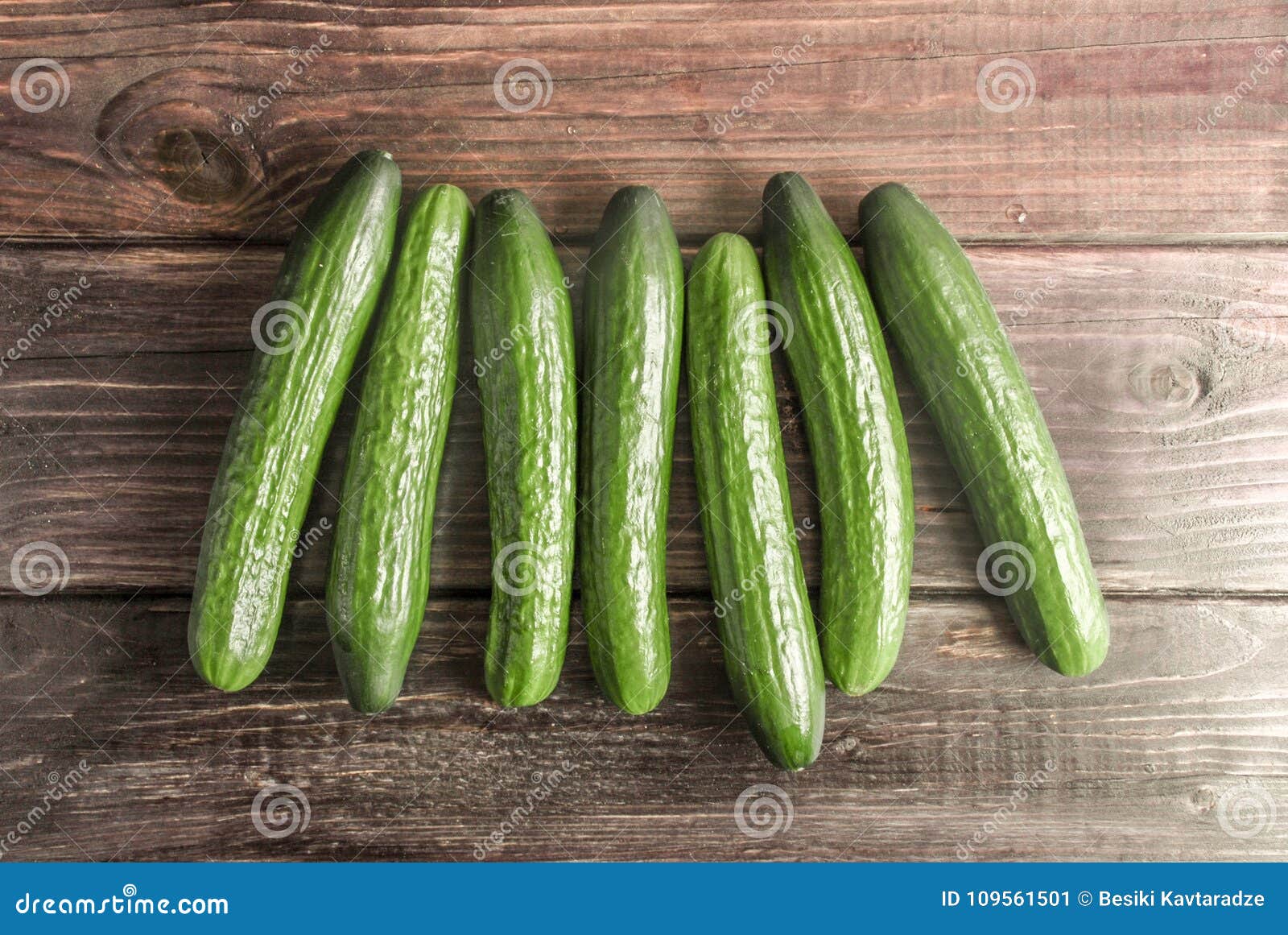 Cucumbers on a wood table stock image. Image of food - 109561501